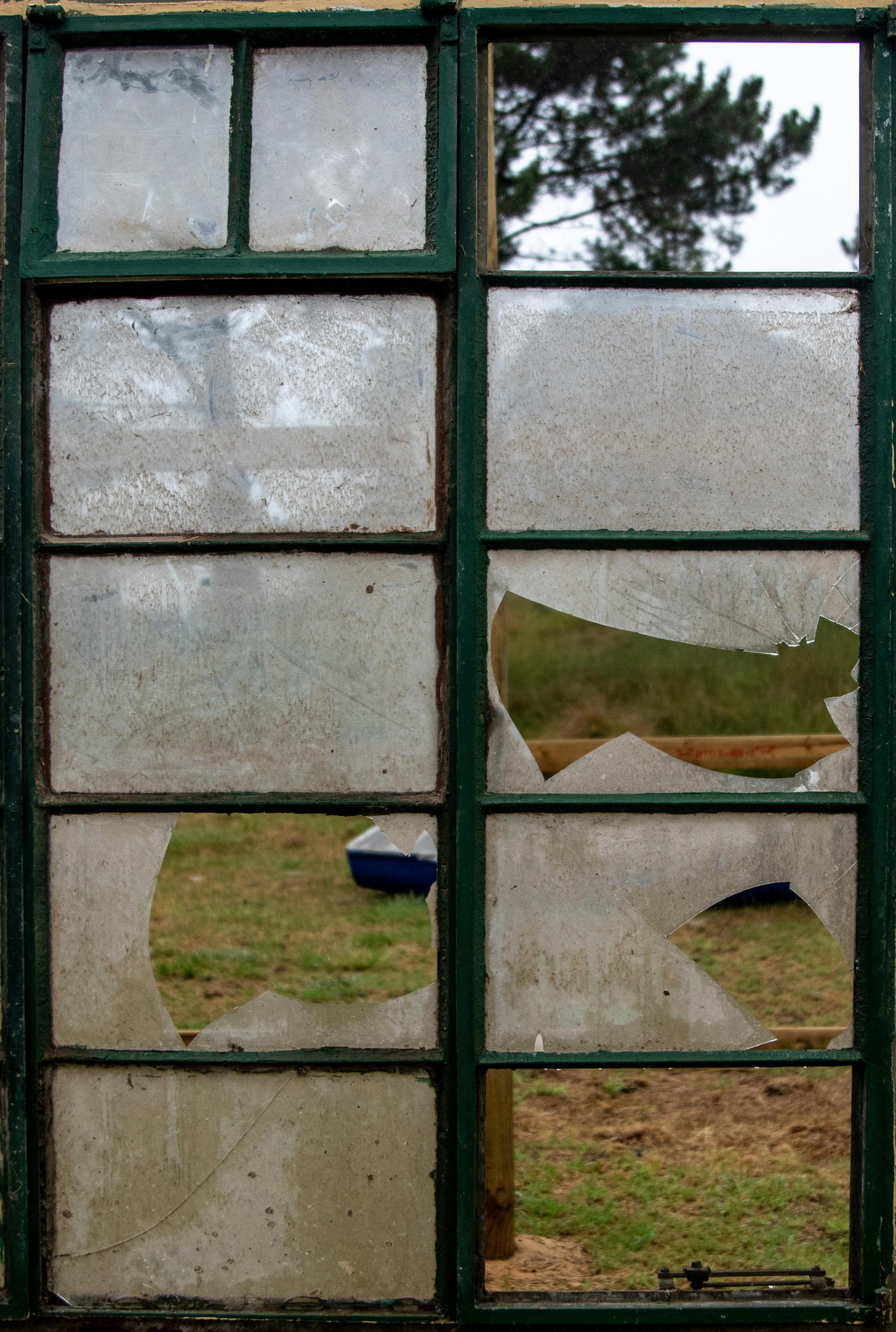 Green Frame of a Broken Window · Free Stock Photo