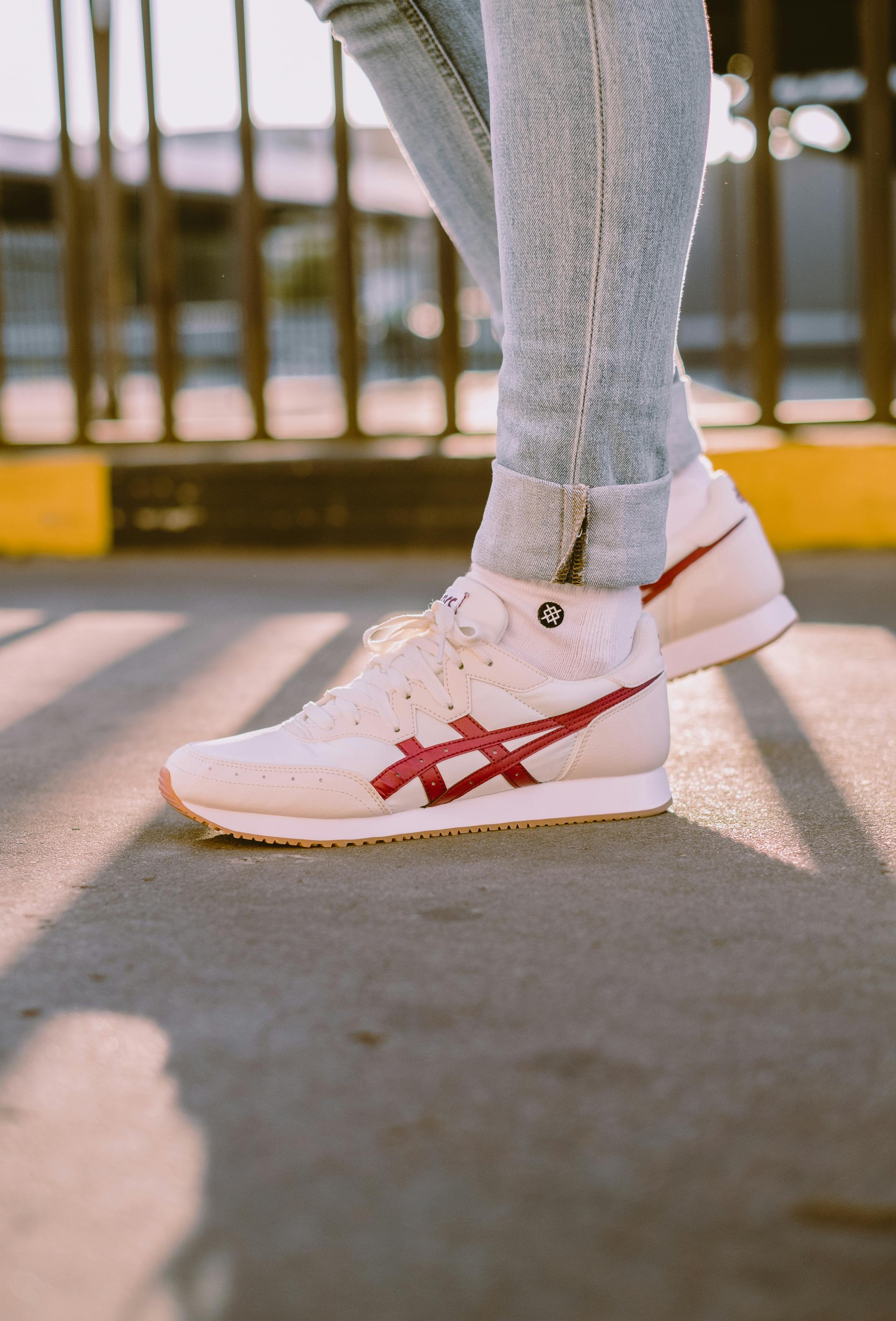 Person Wearing an Asics Footwear · Free Stock Photo