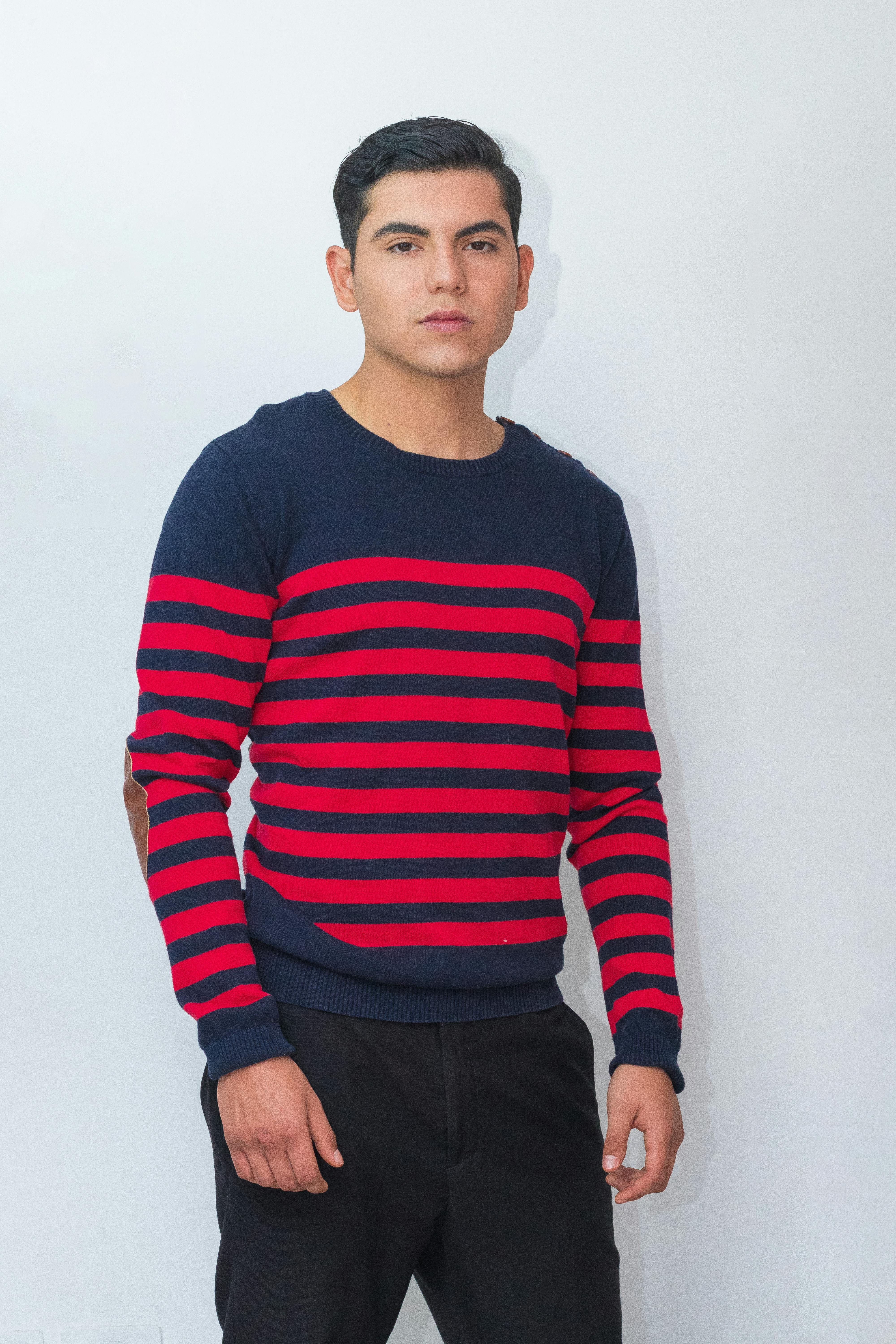 Man in Striped Sweater Posing · Free Stock Photo