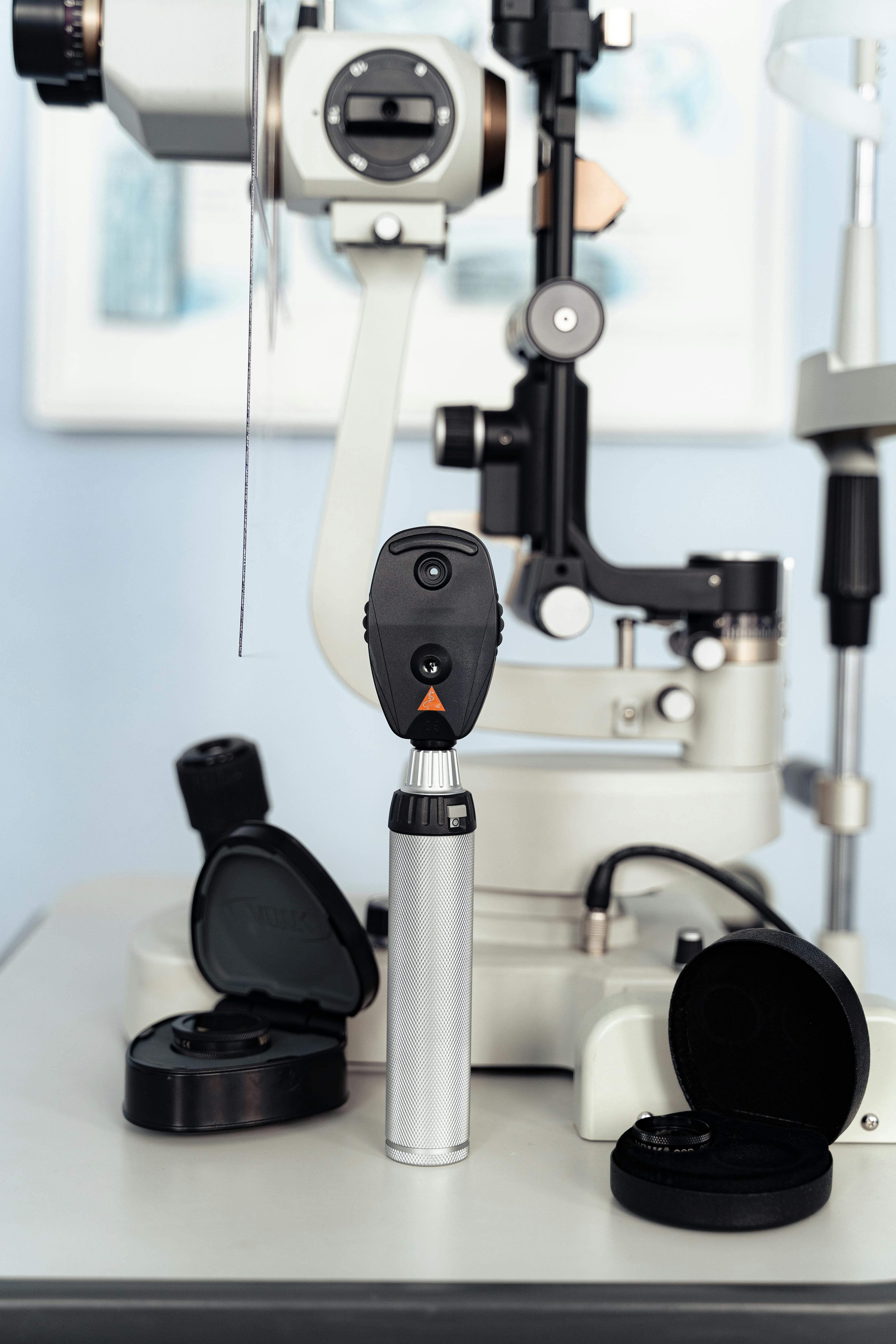 An Ophthalmoscope and an Eye Examination Equipment · Free Stock Photo