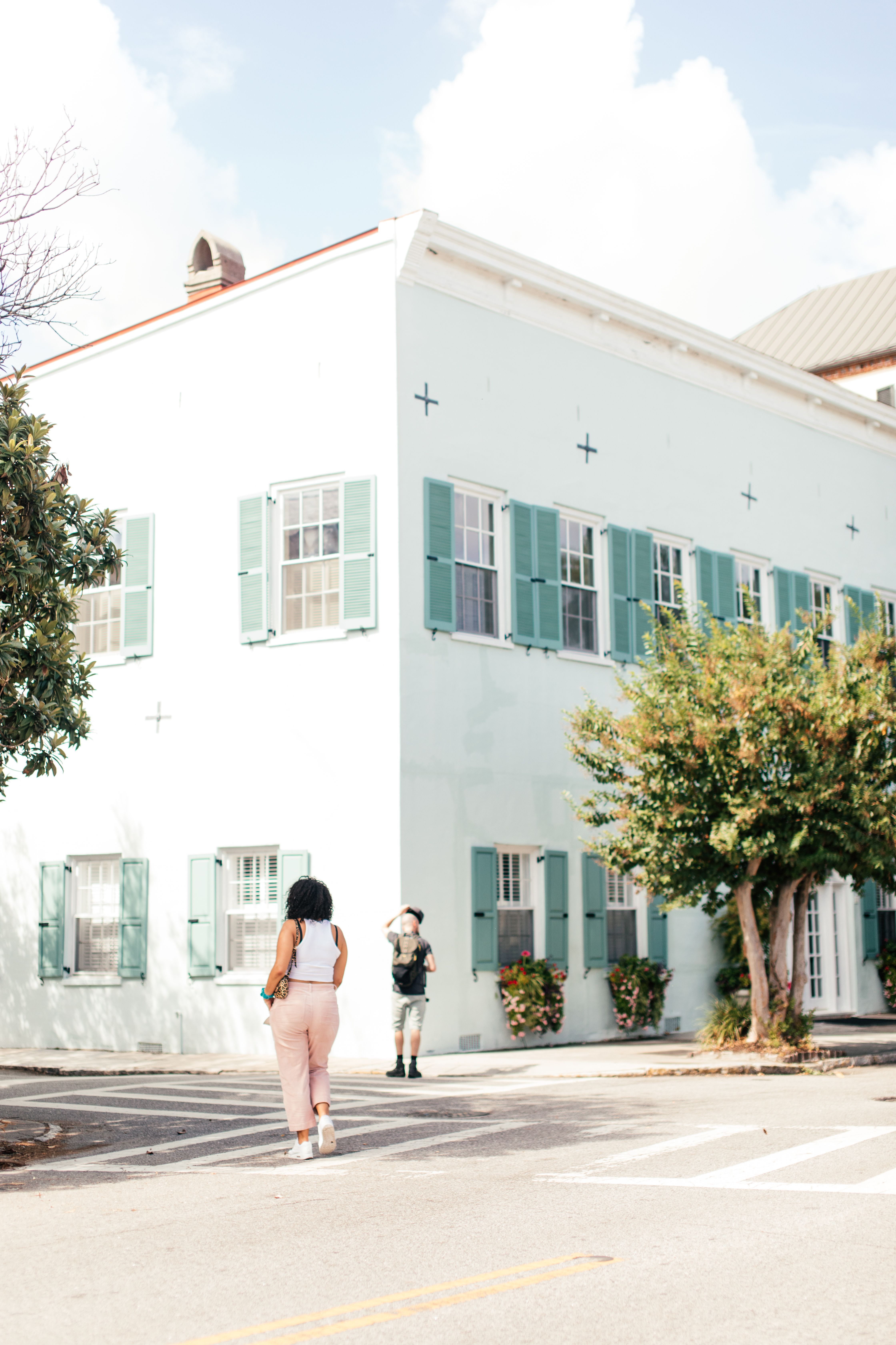 People Standing Beside a Building · Free Stock Photo