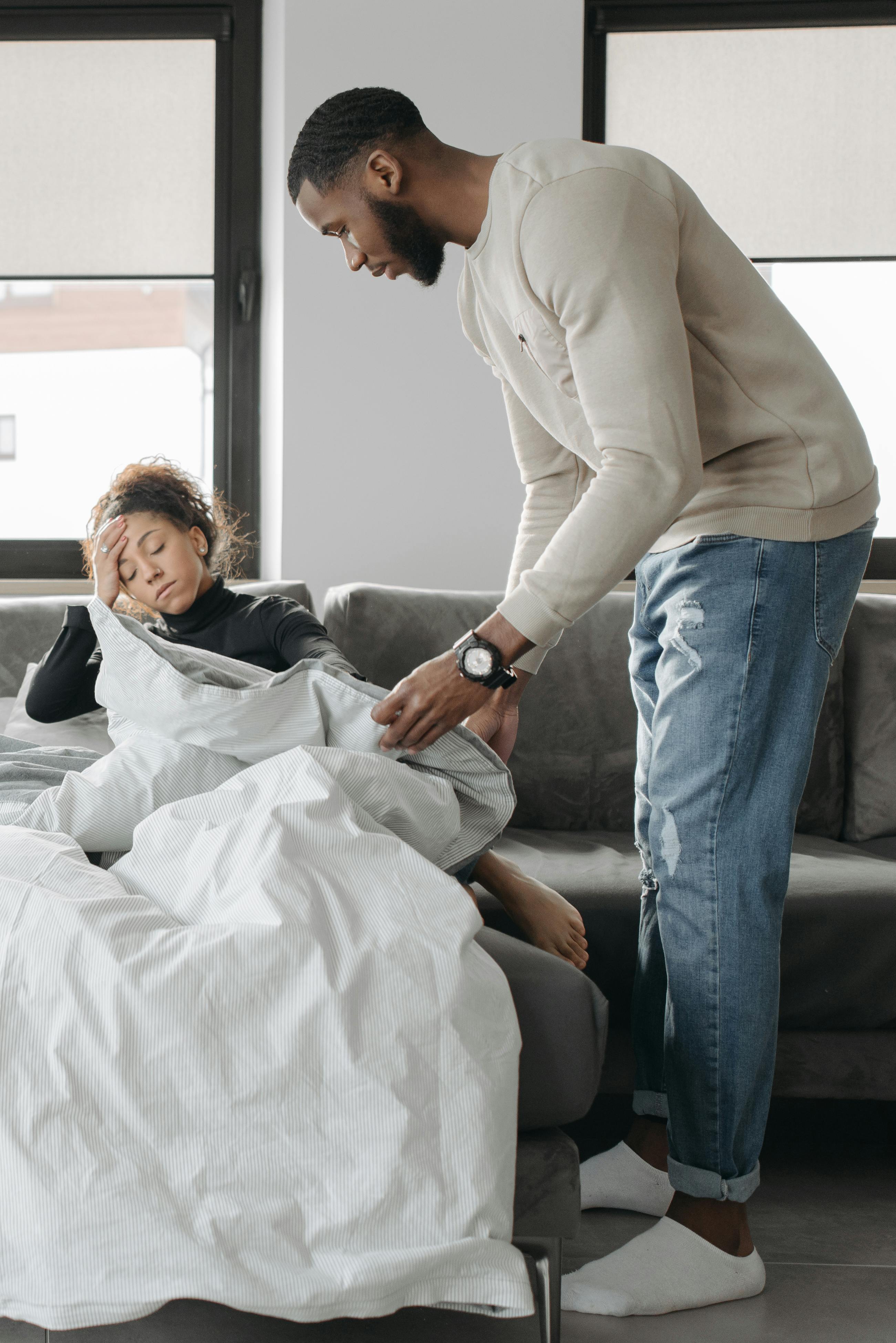 Man Helping A Sick Woman · Free Stock Photo