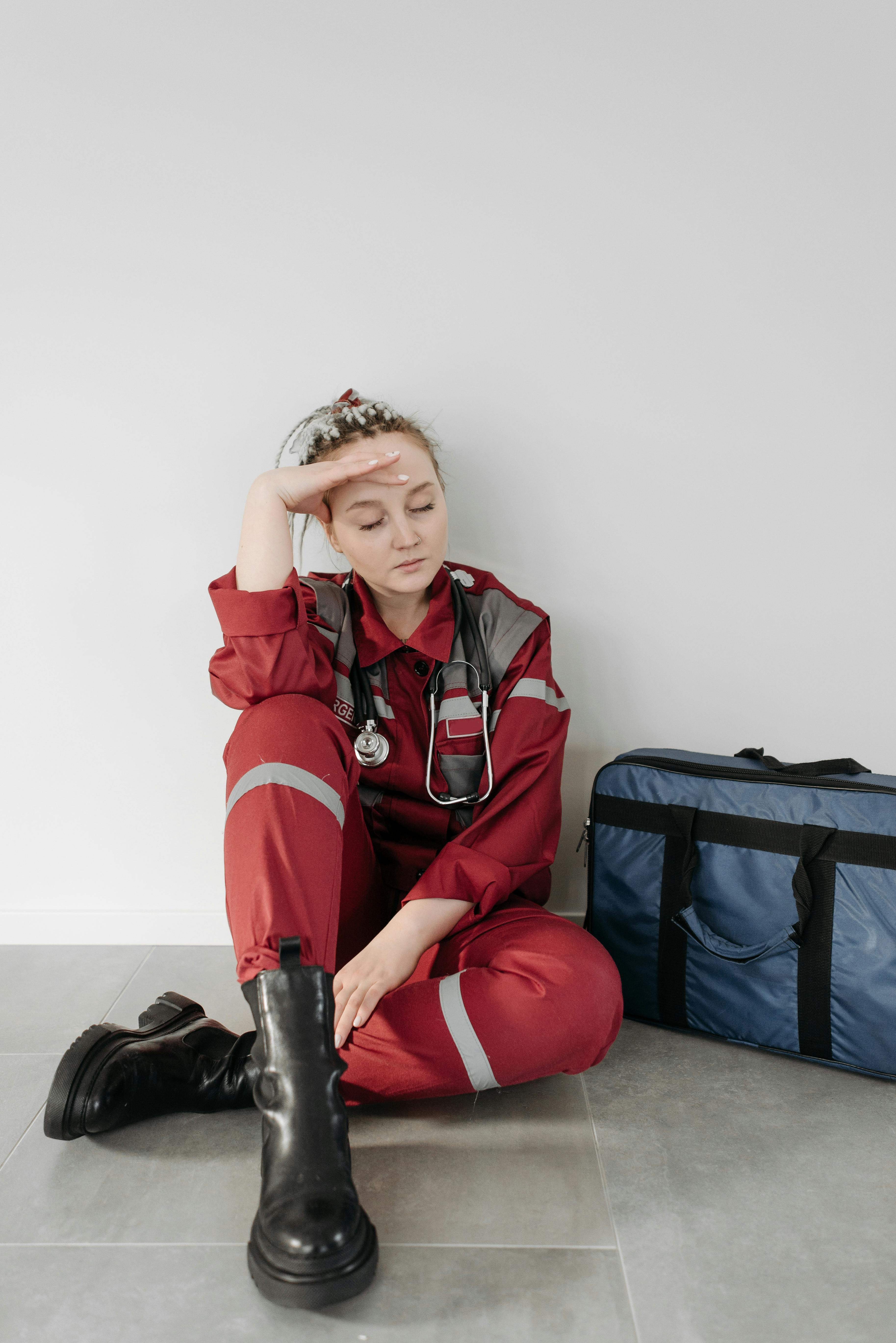 EMT Sitting On The Floor · Free Stock Photo