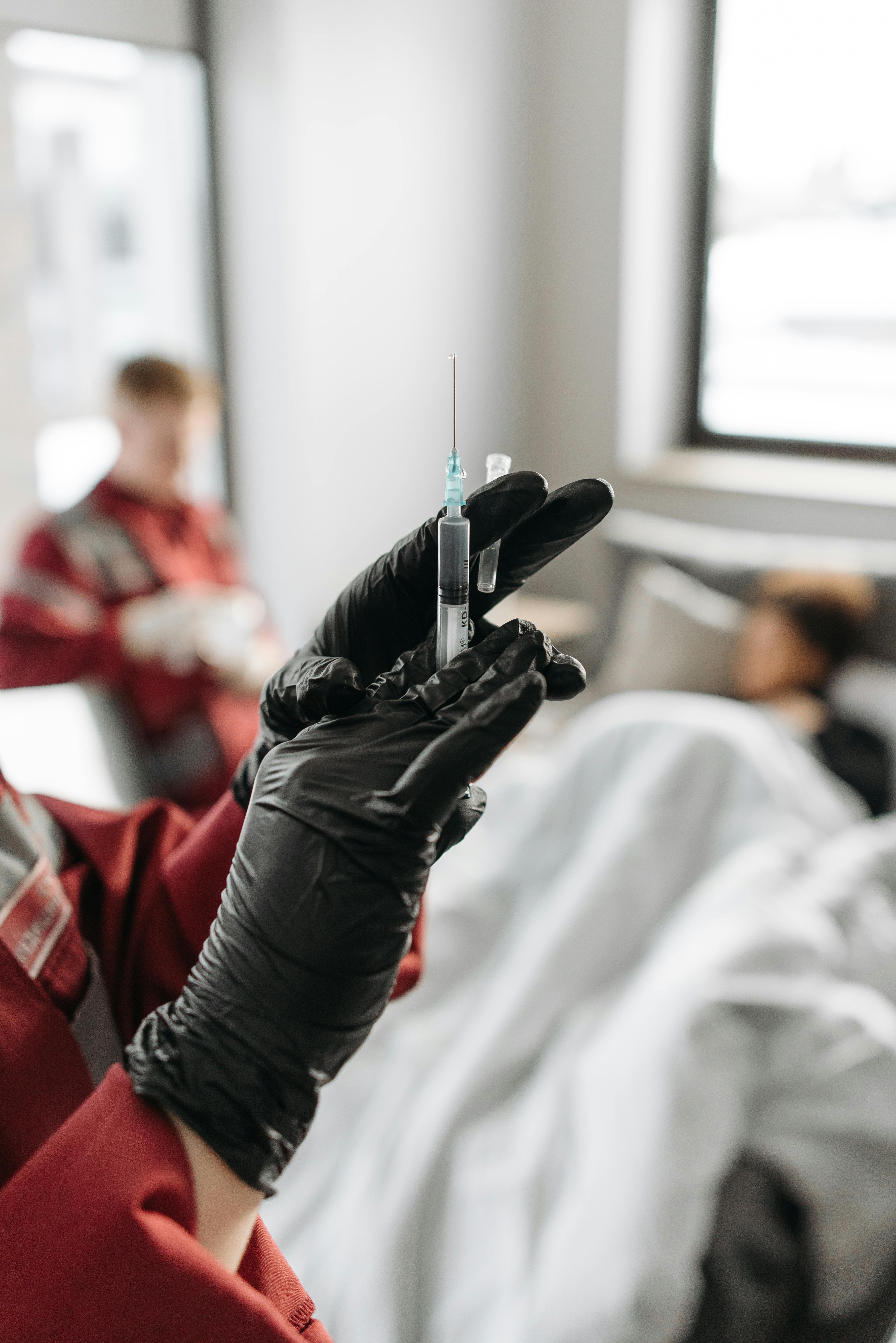 Applying Injection to Woman · Free Stock Photo