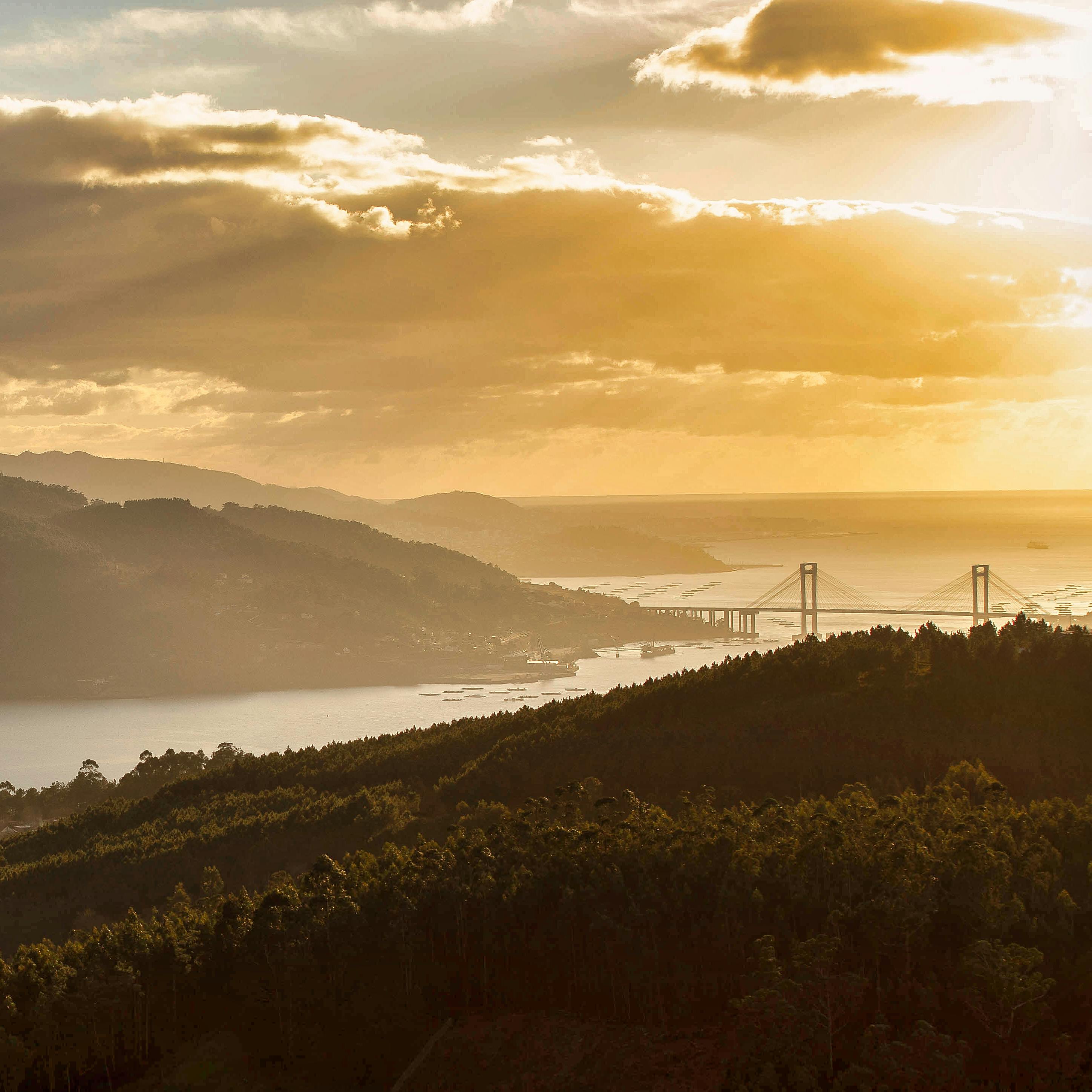 Bridge on Body of Water Near the Mountains · Free Stock Photo