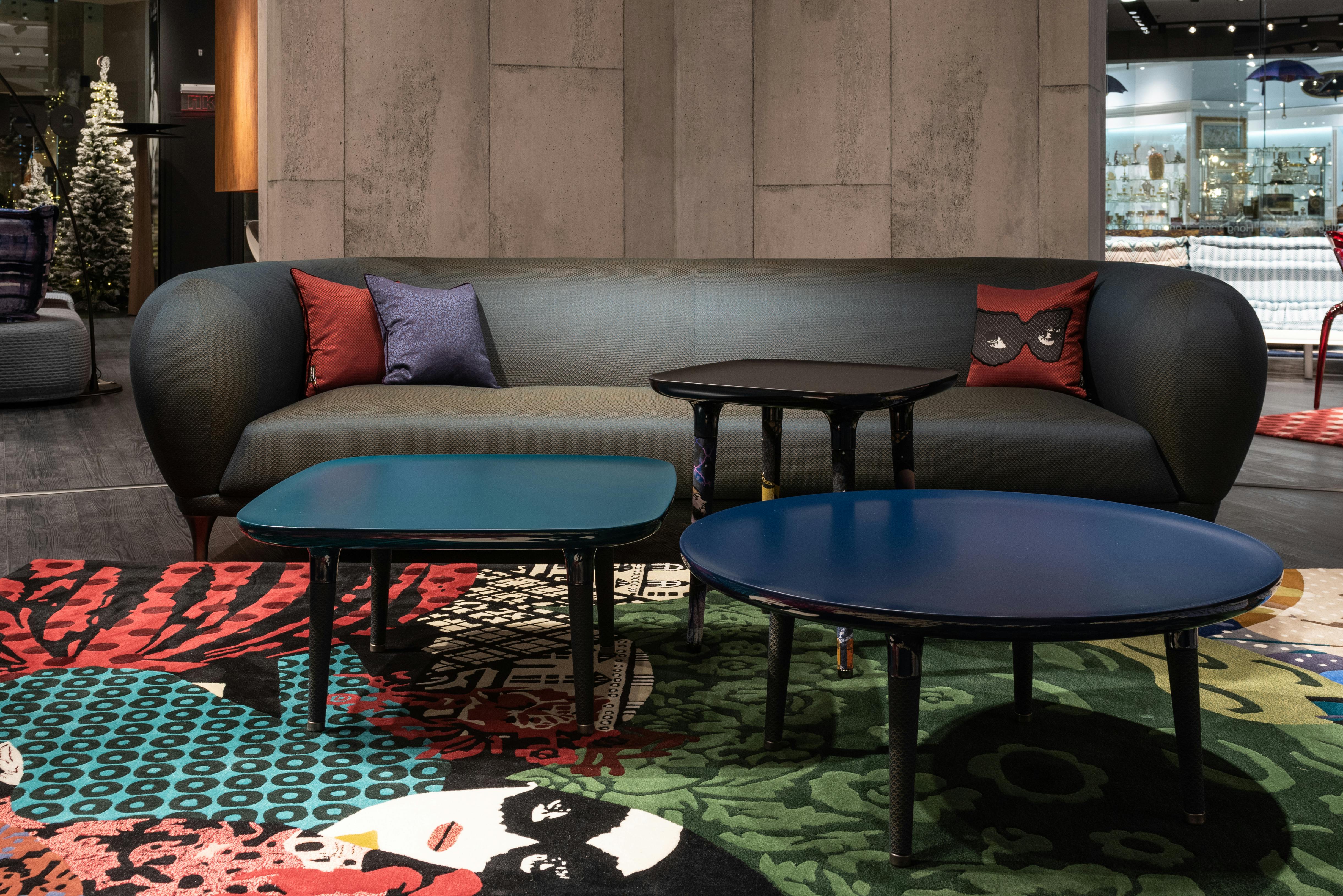 Sofa with cushions at wall · Free Stock Photo