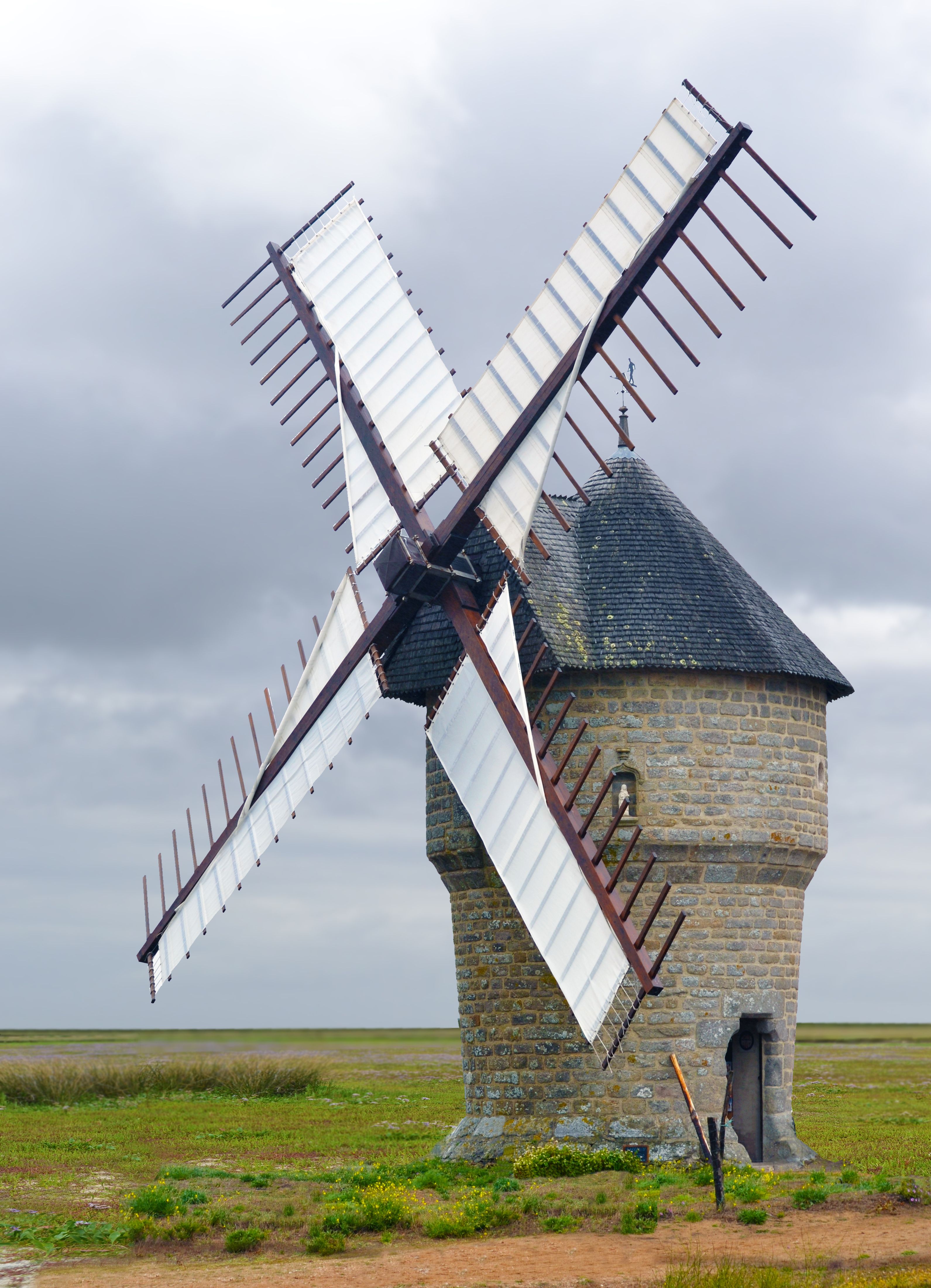 Concrete Windmill on Green Grass · Free Stock Photo
