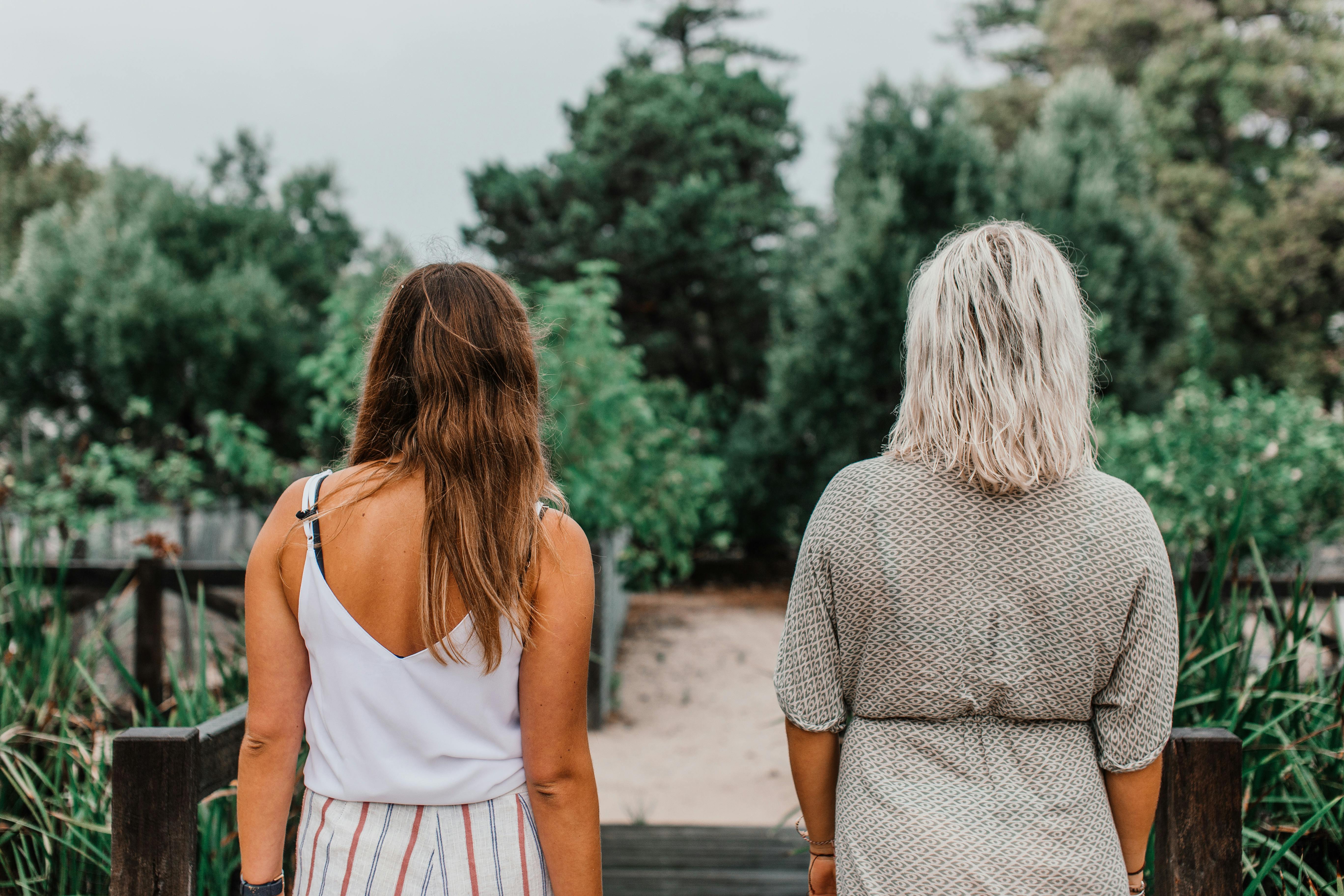 Back View of Women Standing Beside Each Other · Free Stock Photo