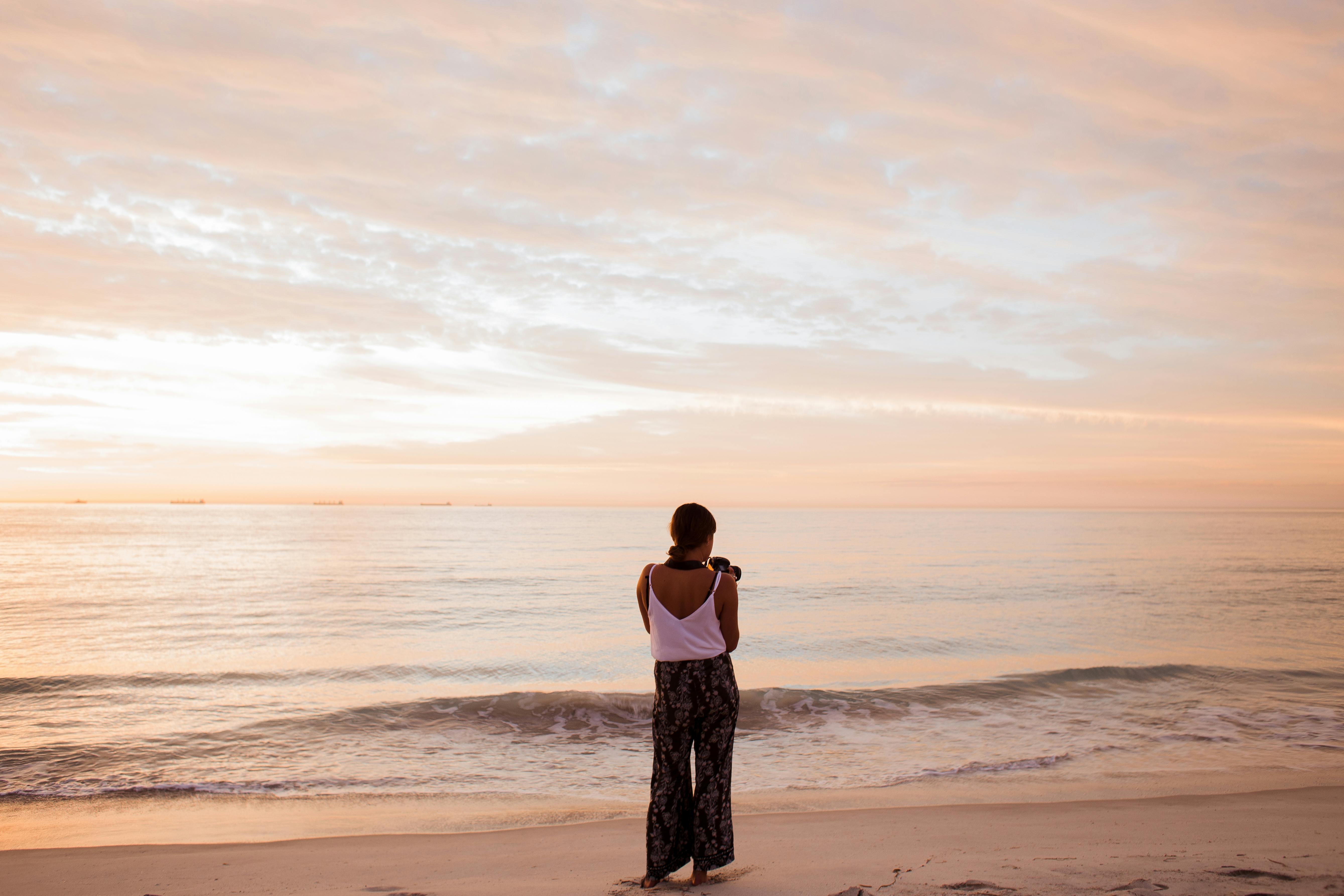 Woman Standing on Beach · Free Stock Photo