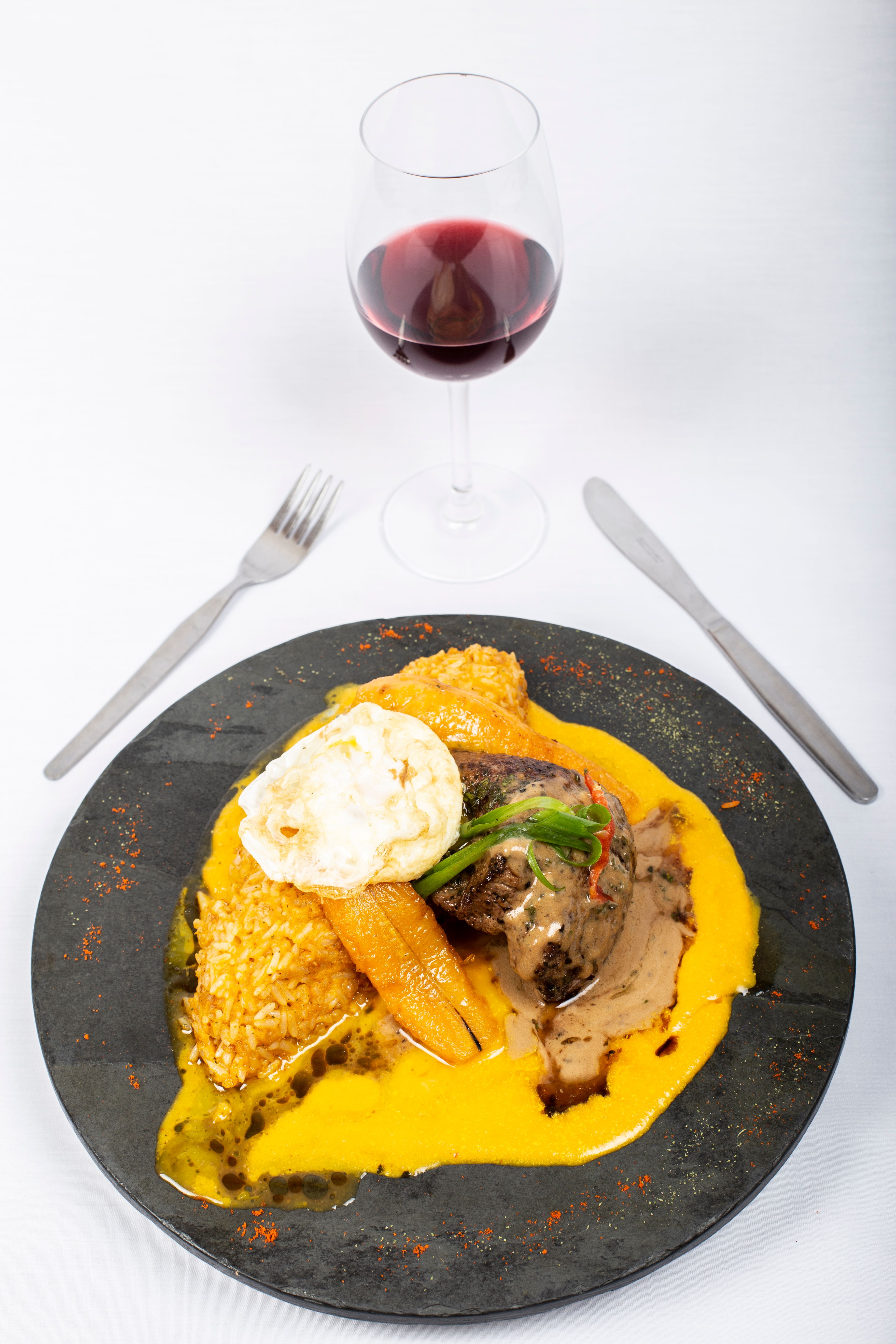 Cooked Food on Black Ceramic Plate · Free Stock Photo