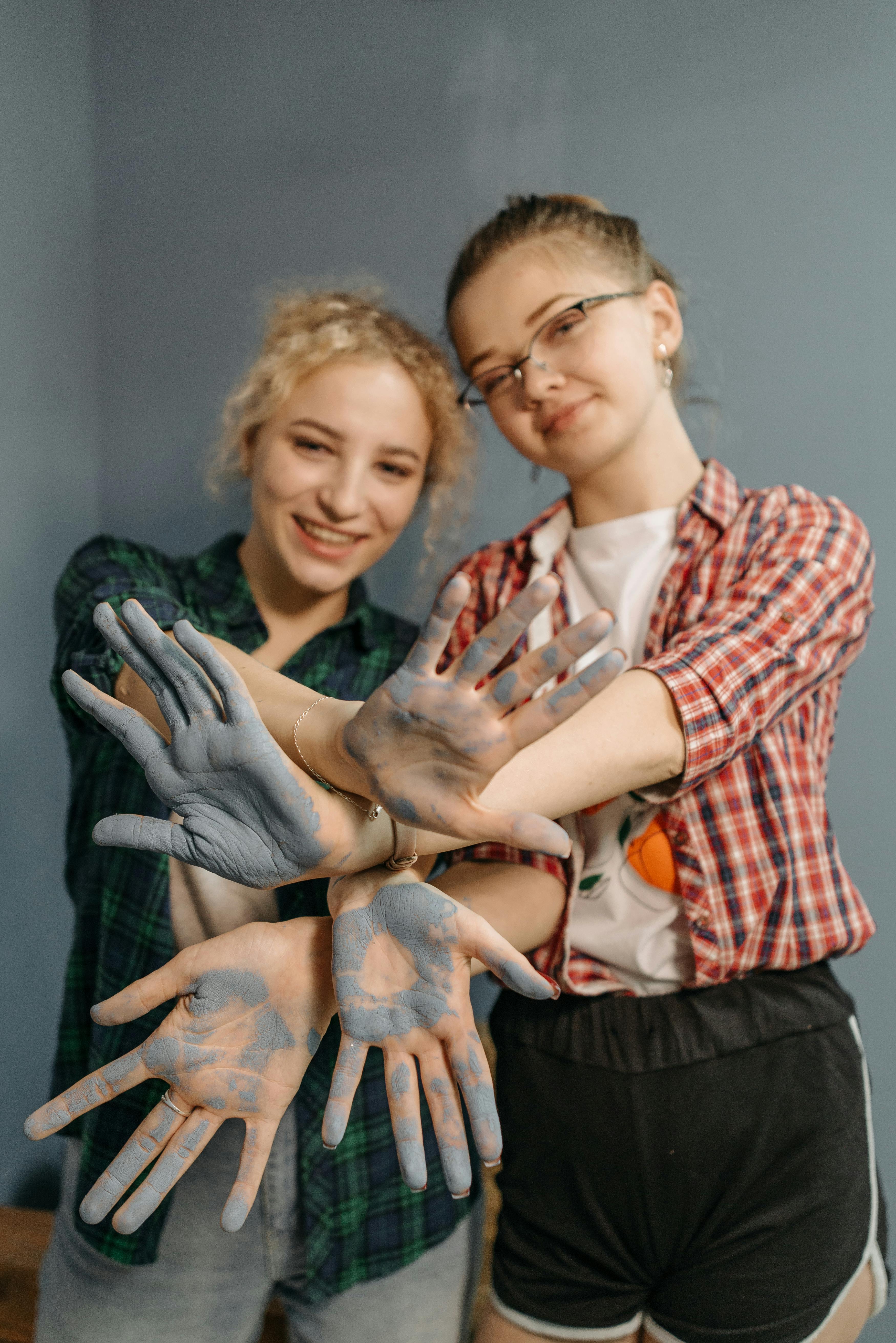 Woman Fidgeting with Gold Paperclip · Free Stock Photo