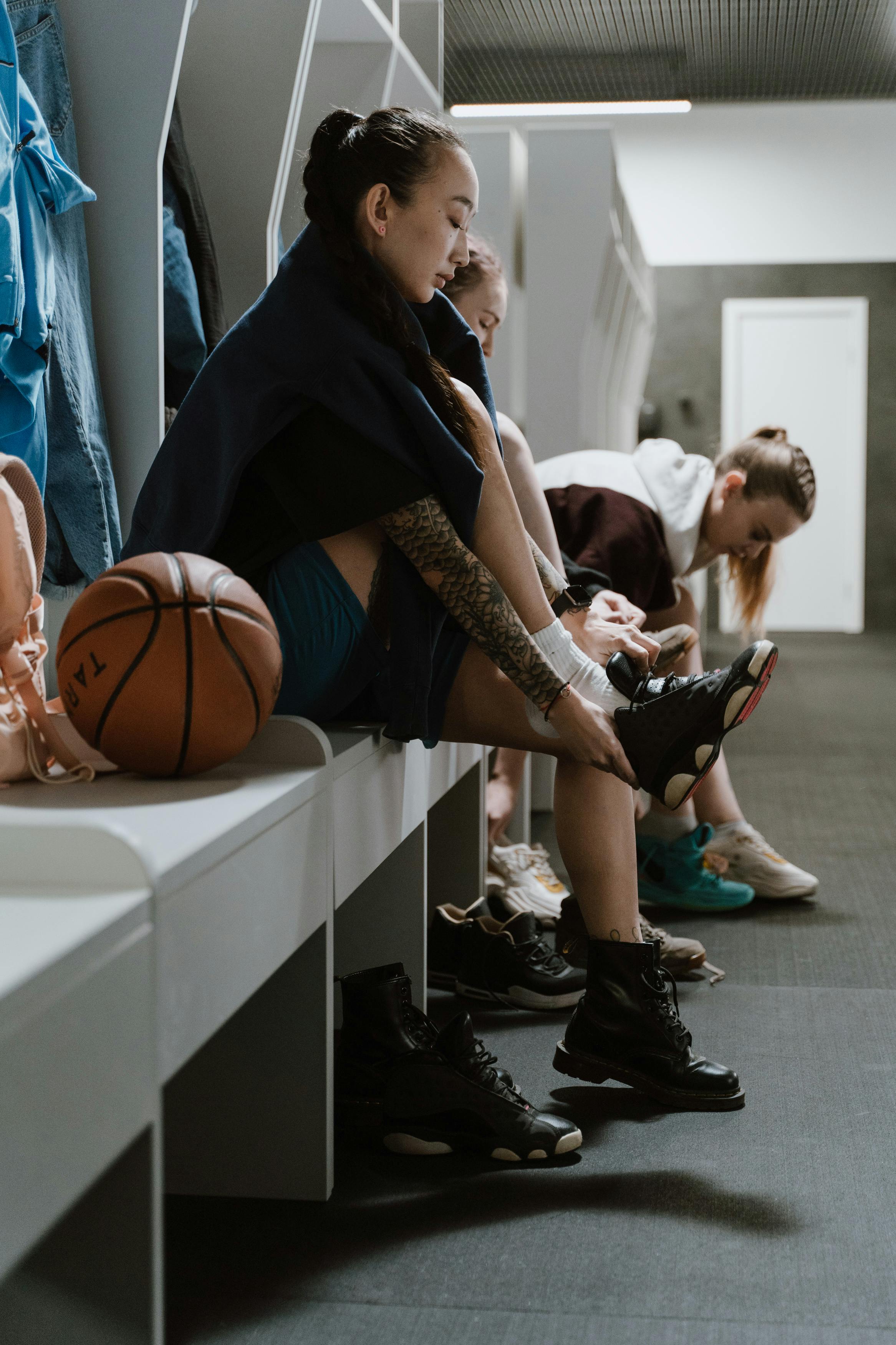 Girls in Sports Clothing Getting Dressed in a Changing Room for a ...