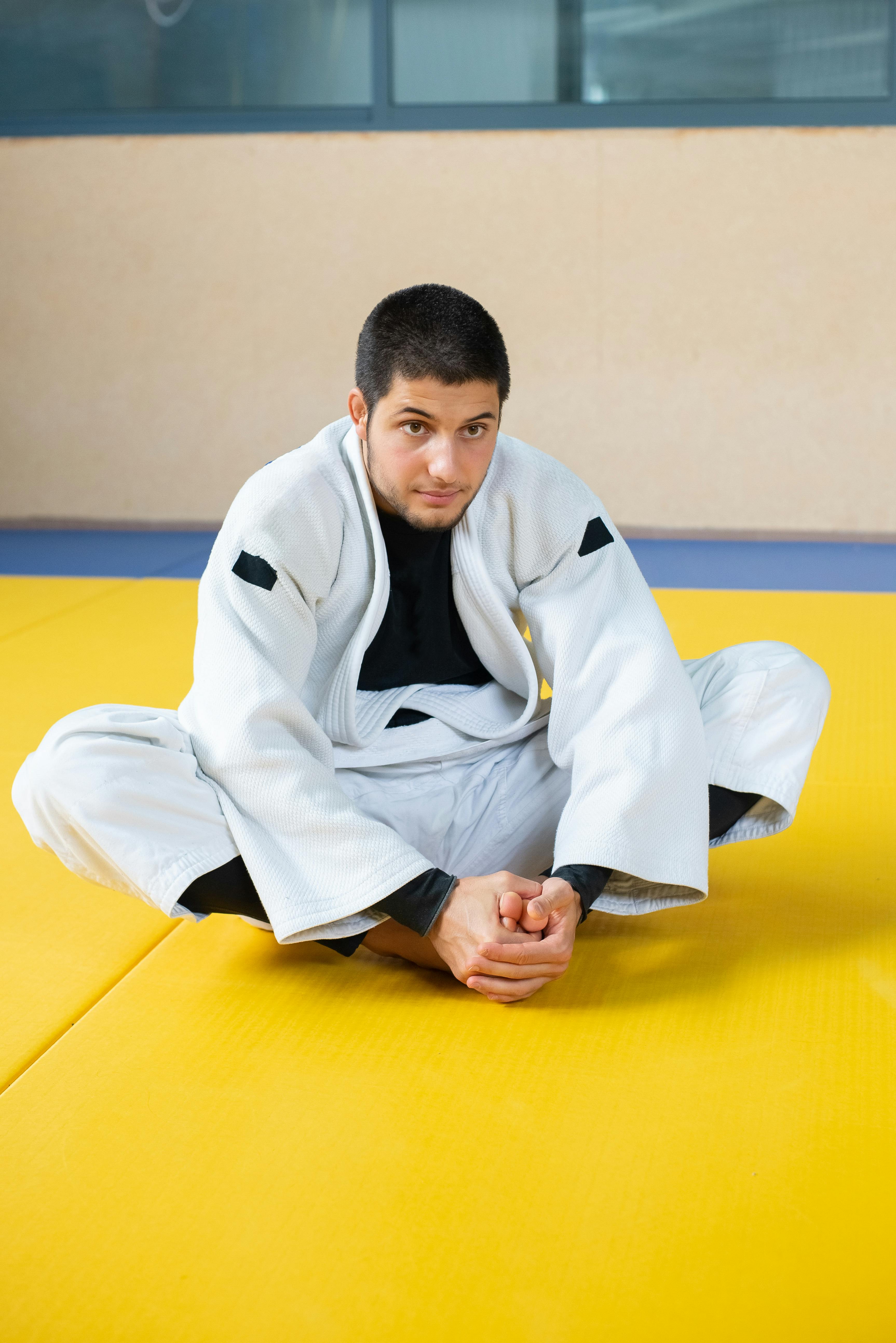 A People wearing Judo Uniform Sitting Together · Free Stock Photo