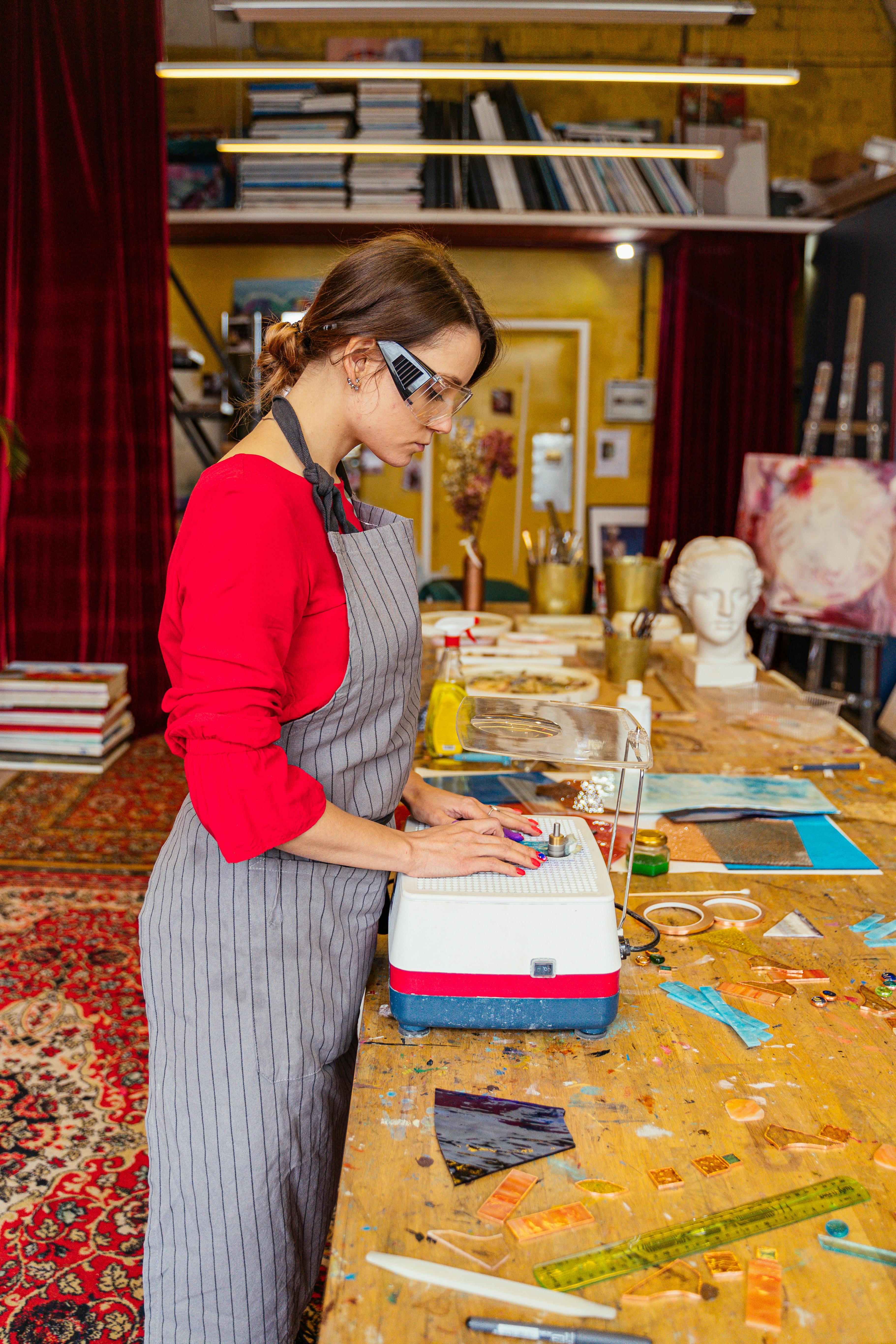 Woman Working by Workshop Bench · Free Stock Photo