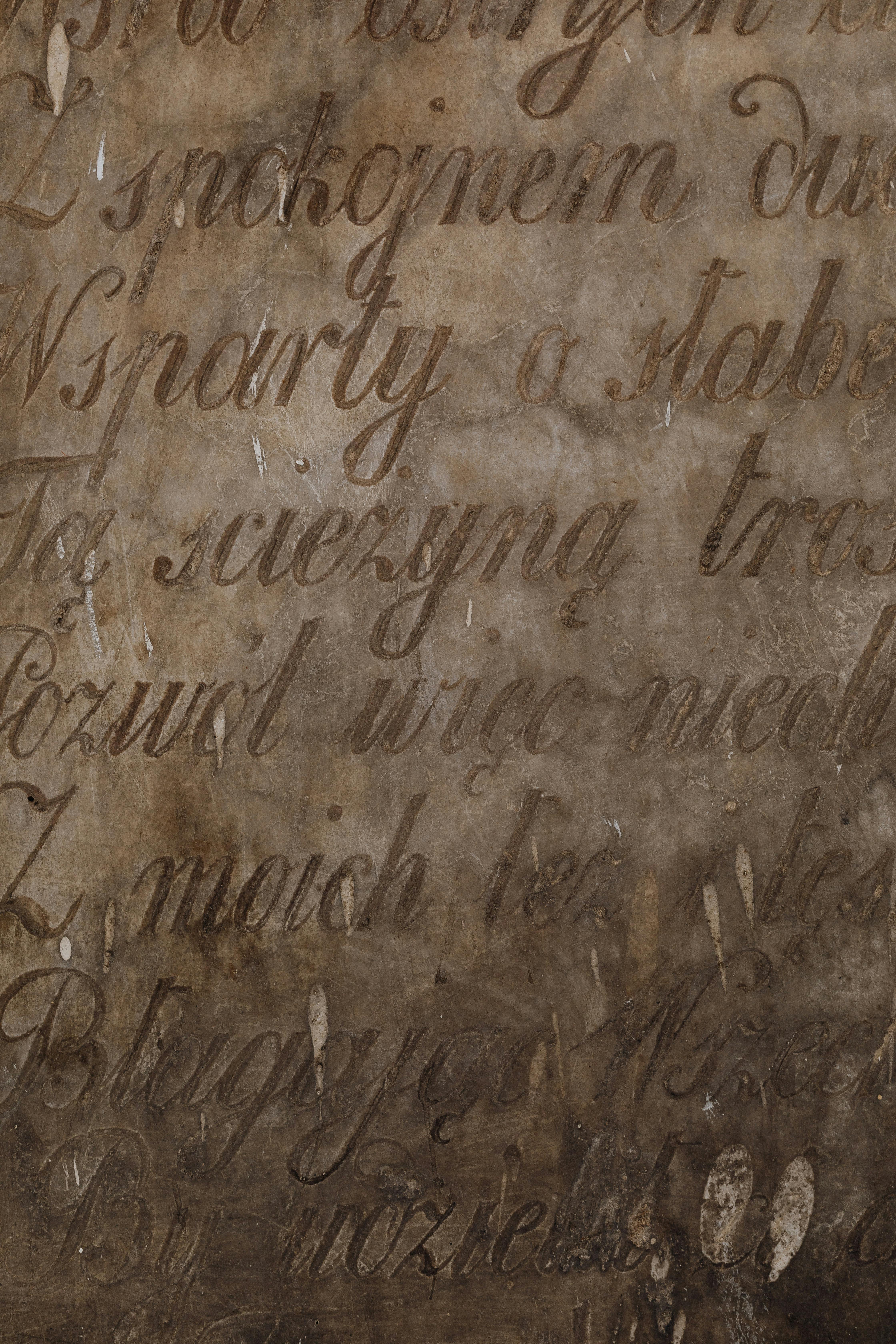 A Close-up Shot of an Old Inscription on a Marble · Free Stock Photo