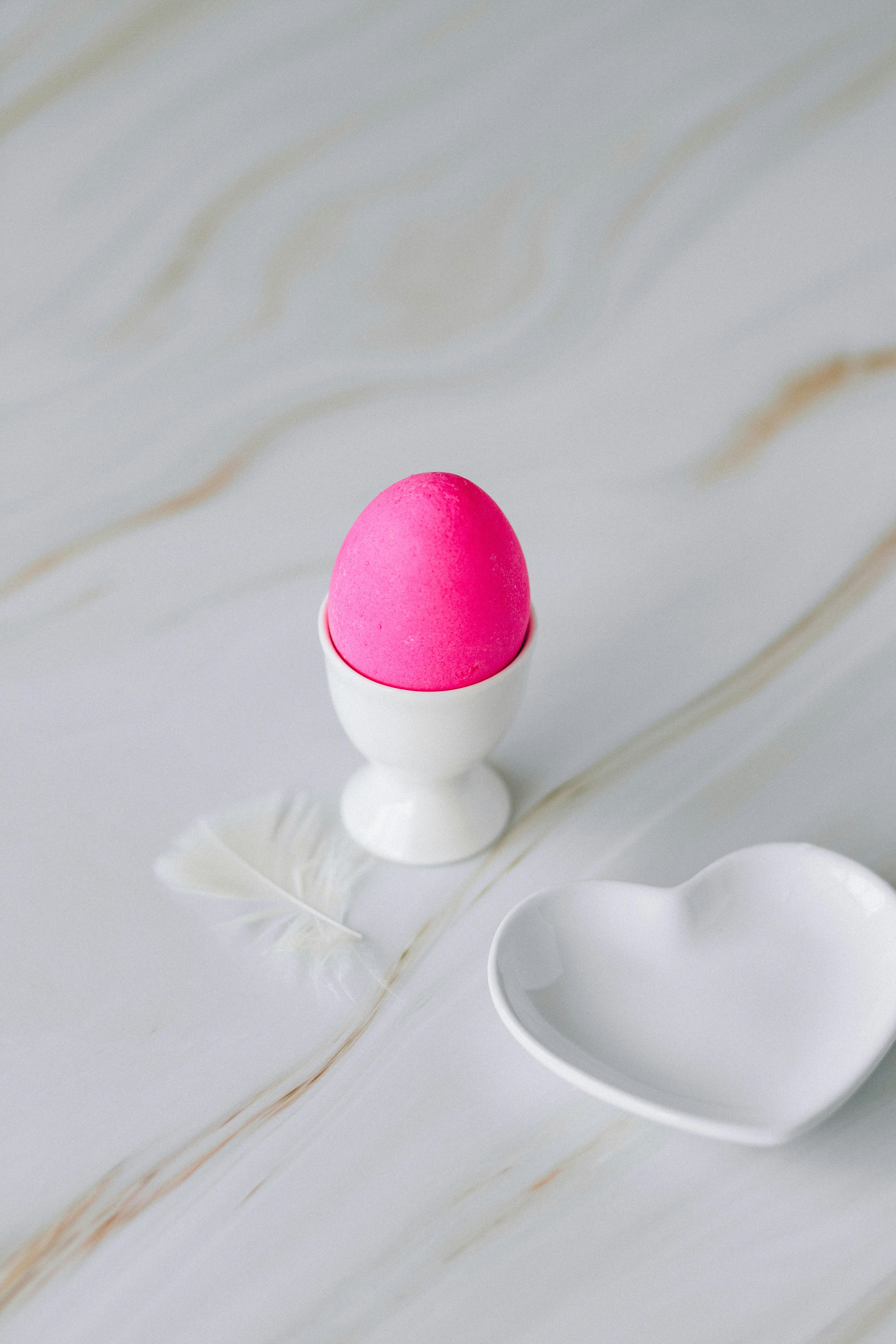 Photograph of a Pink Egg on an Egg Cup · Free Stock Photo