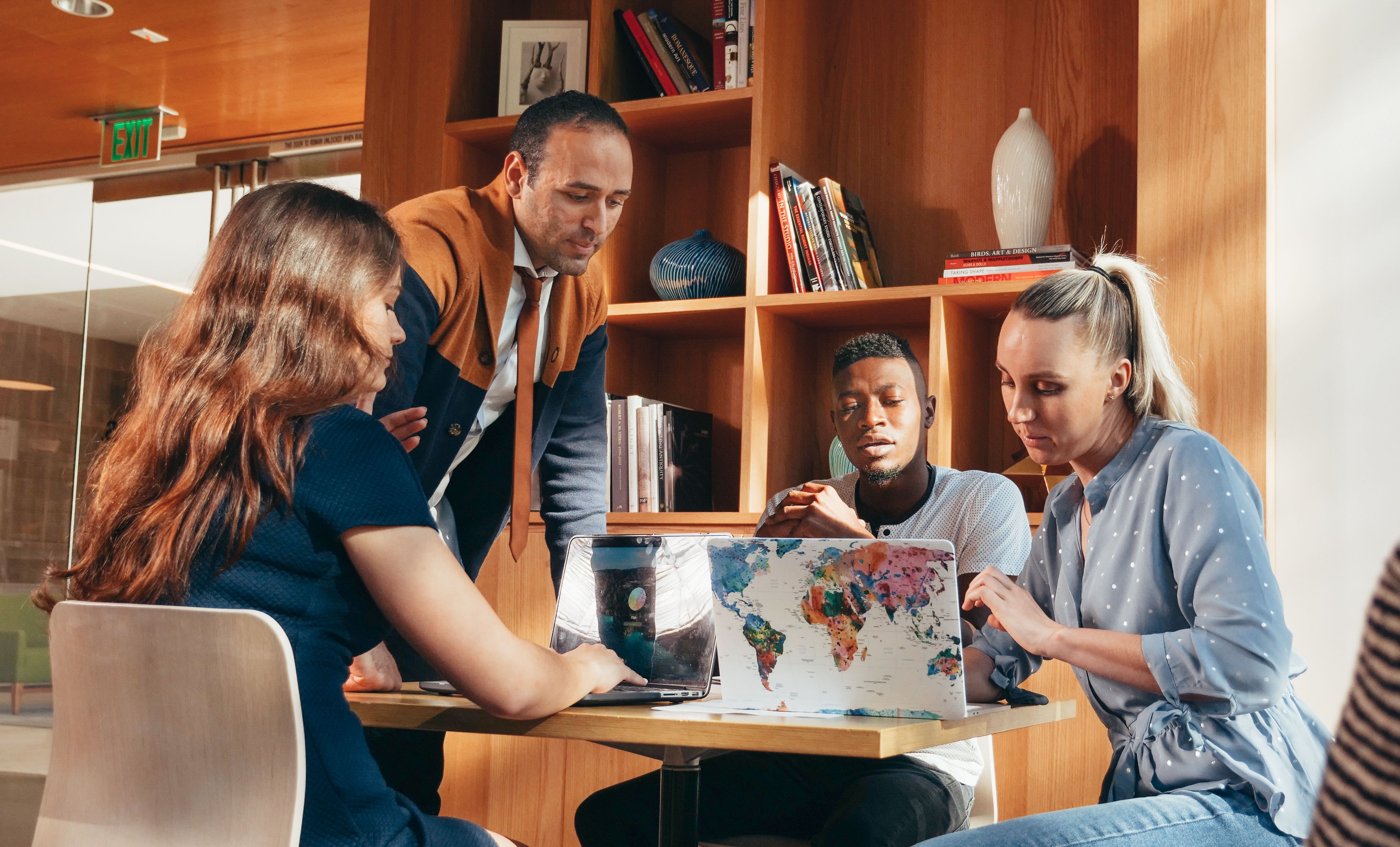 Colleagues Discussing Ideas while in the Office · Free Stock Photo