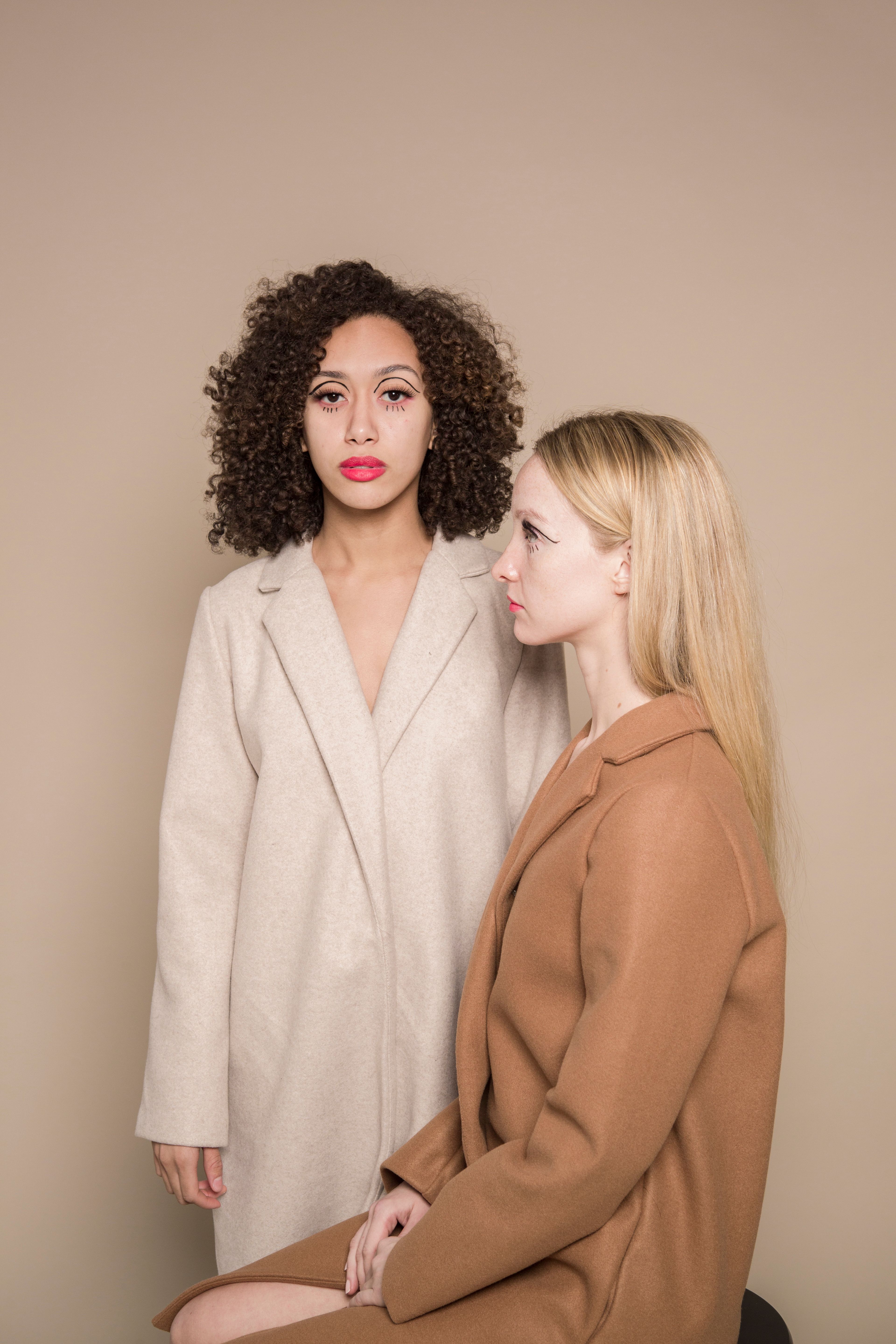 Stylish multiracial extravagant women in fashionable beige coats · Free ...