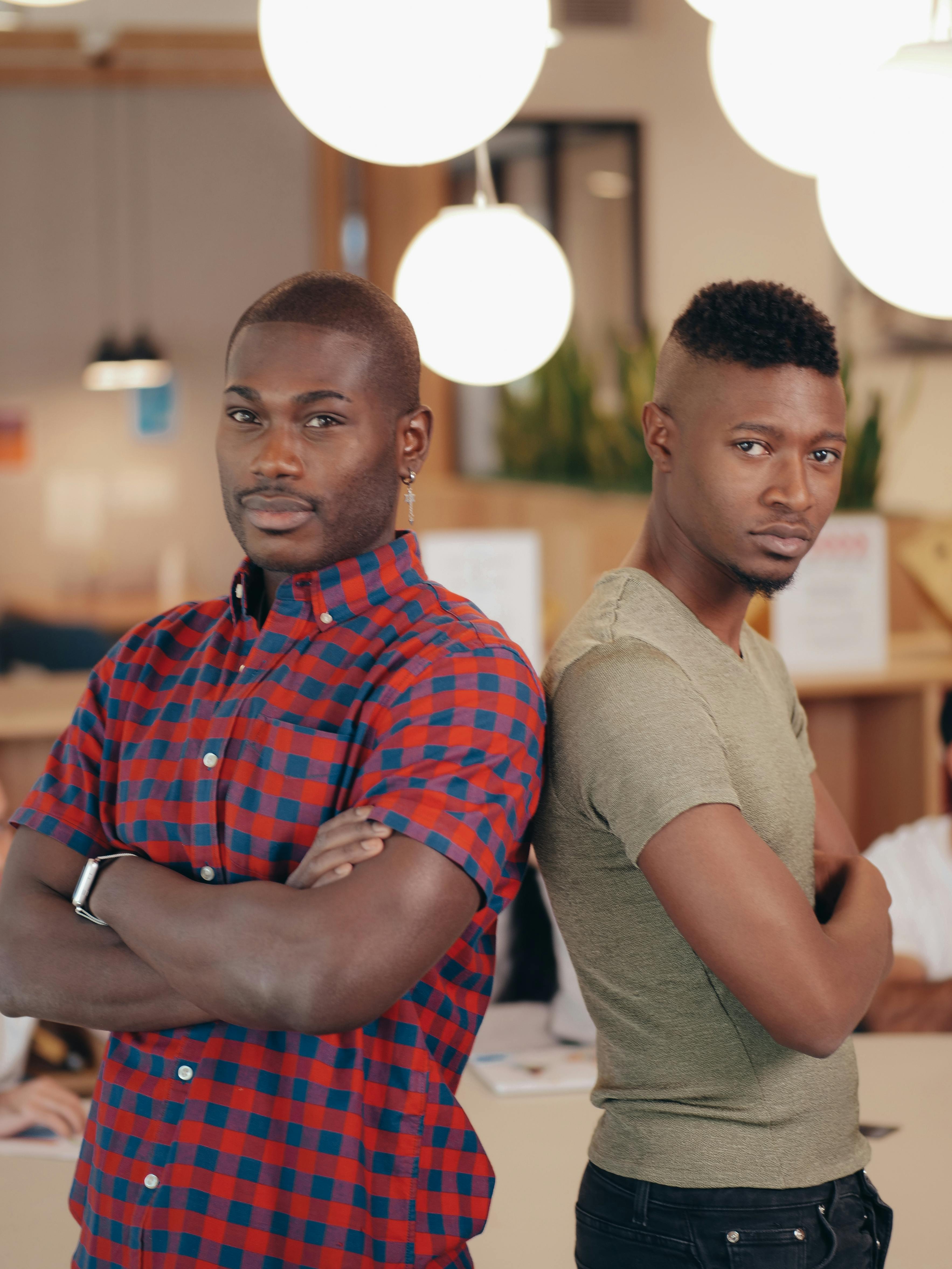 Men Standing Back to Back · Free Stock Photo