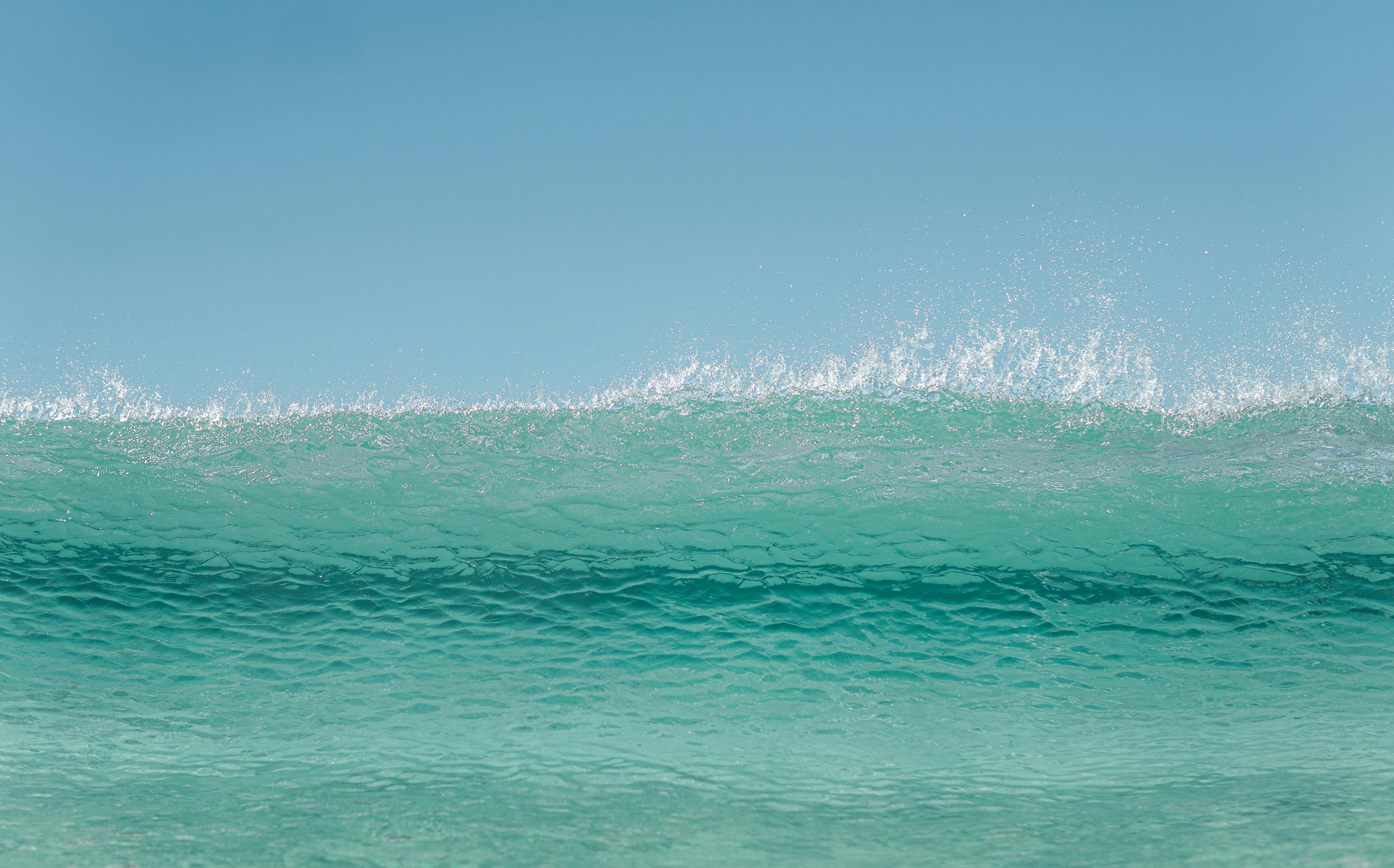 Stormy blue sea in sunlight · Free Stock Photo