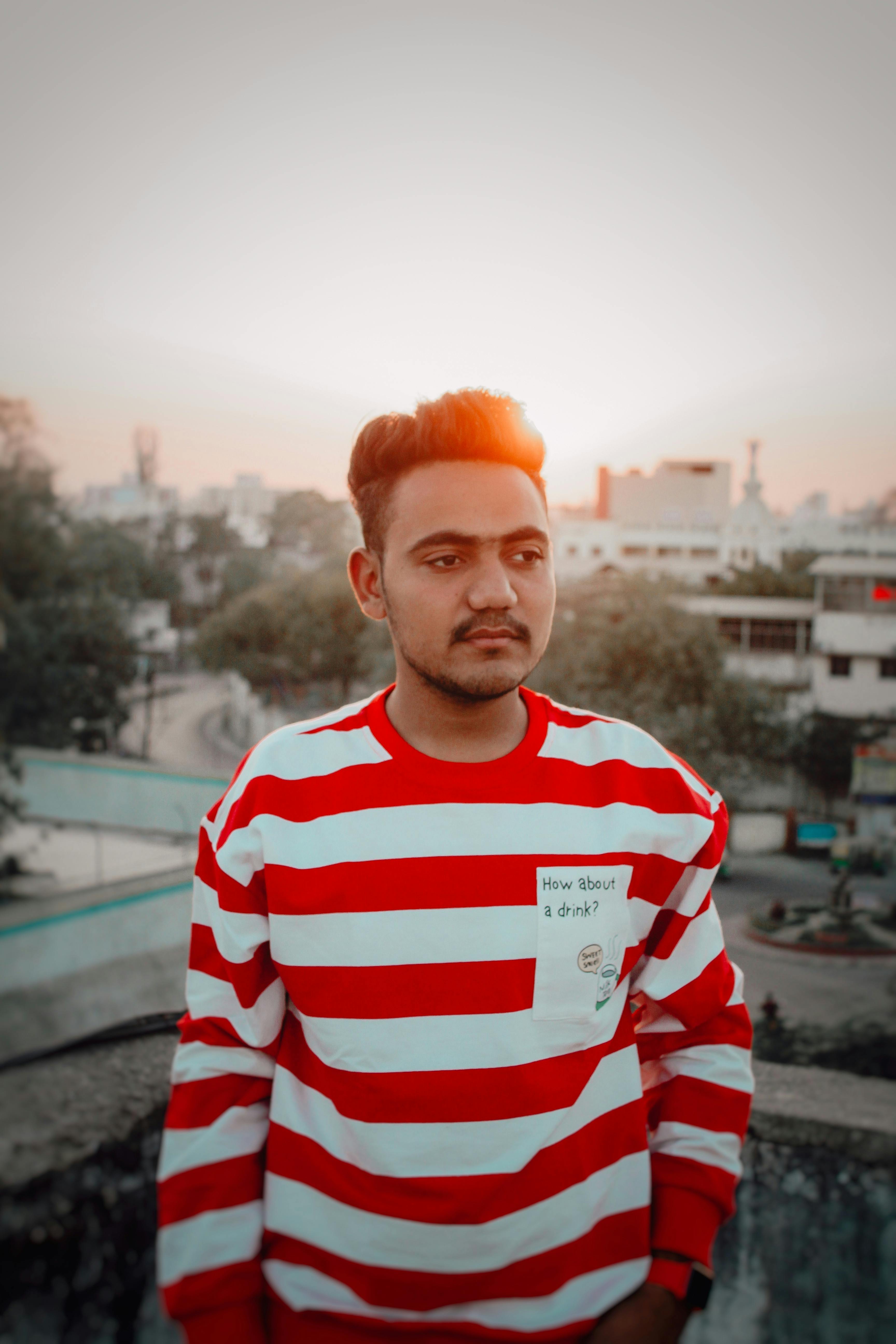 A Man in Red and White Striped Shirt · Free Stock Photo