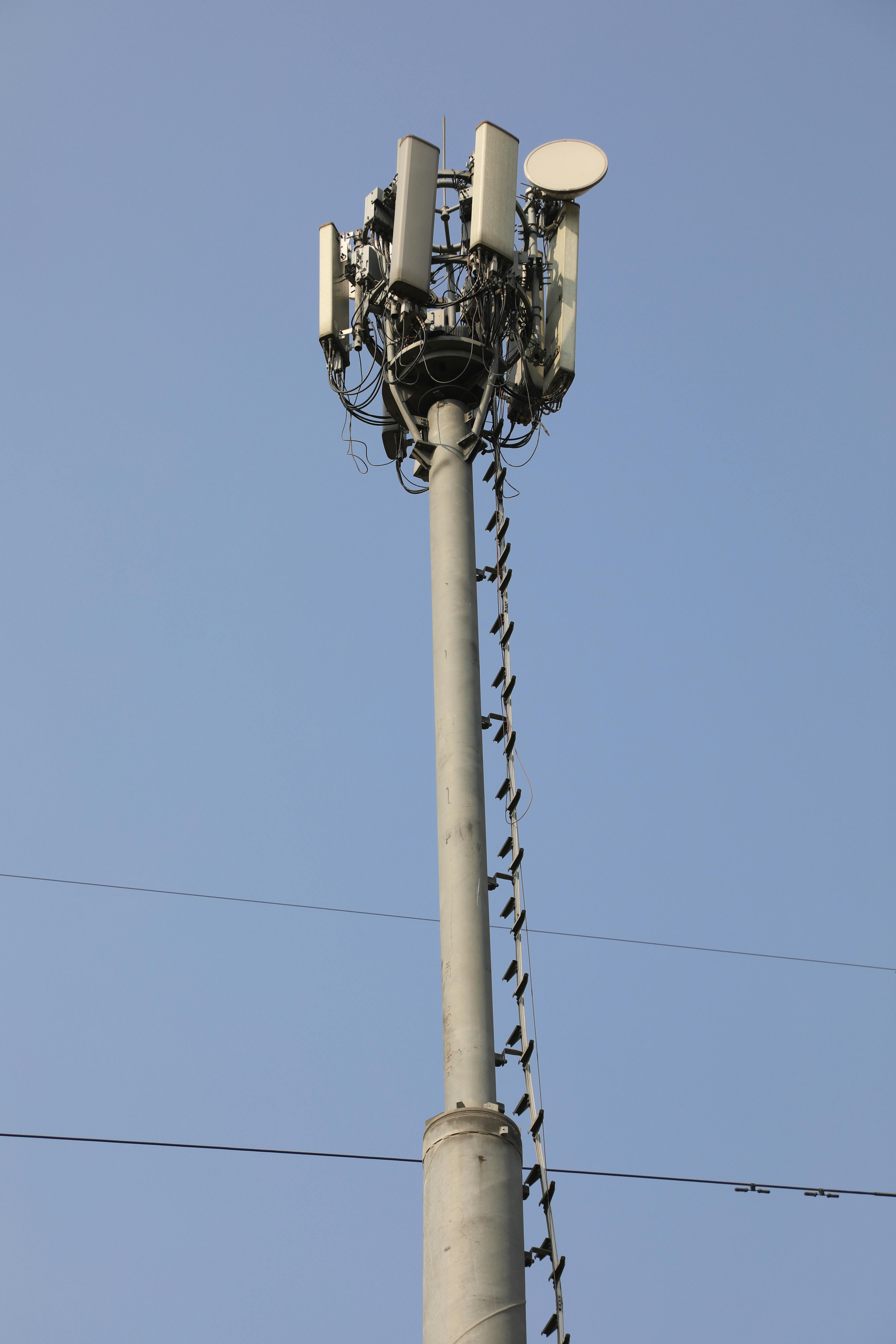 A Communication Tower Under the Blue Sky · Free Stock Photo
