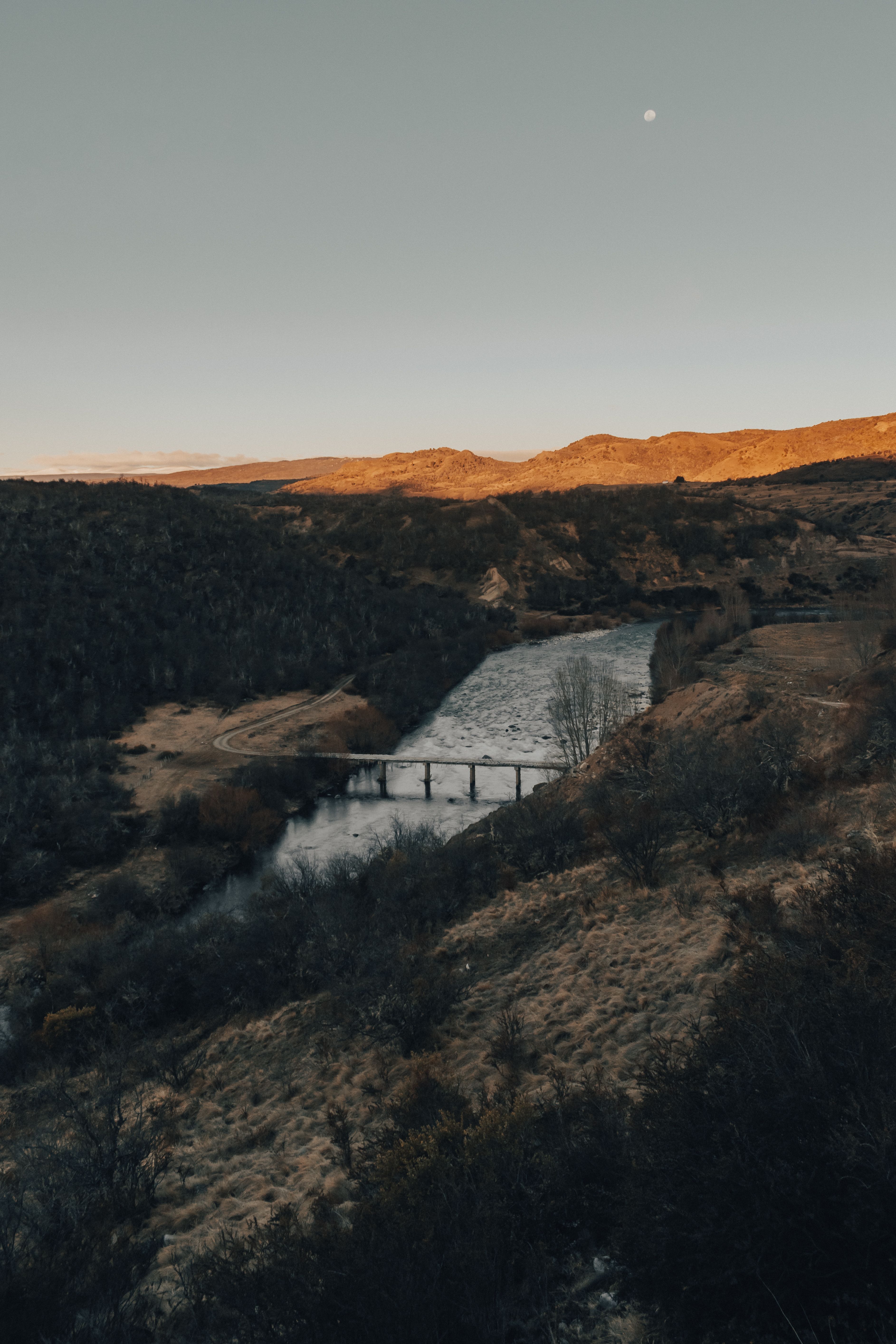Bridge between Brown Mountains · Free Stock Photo