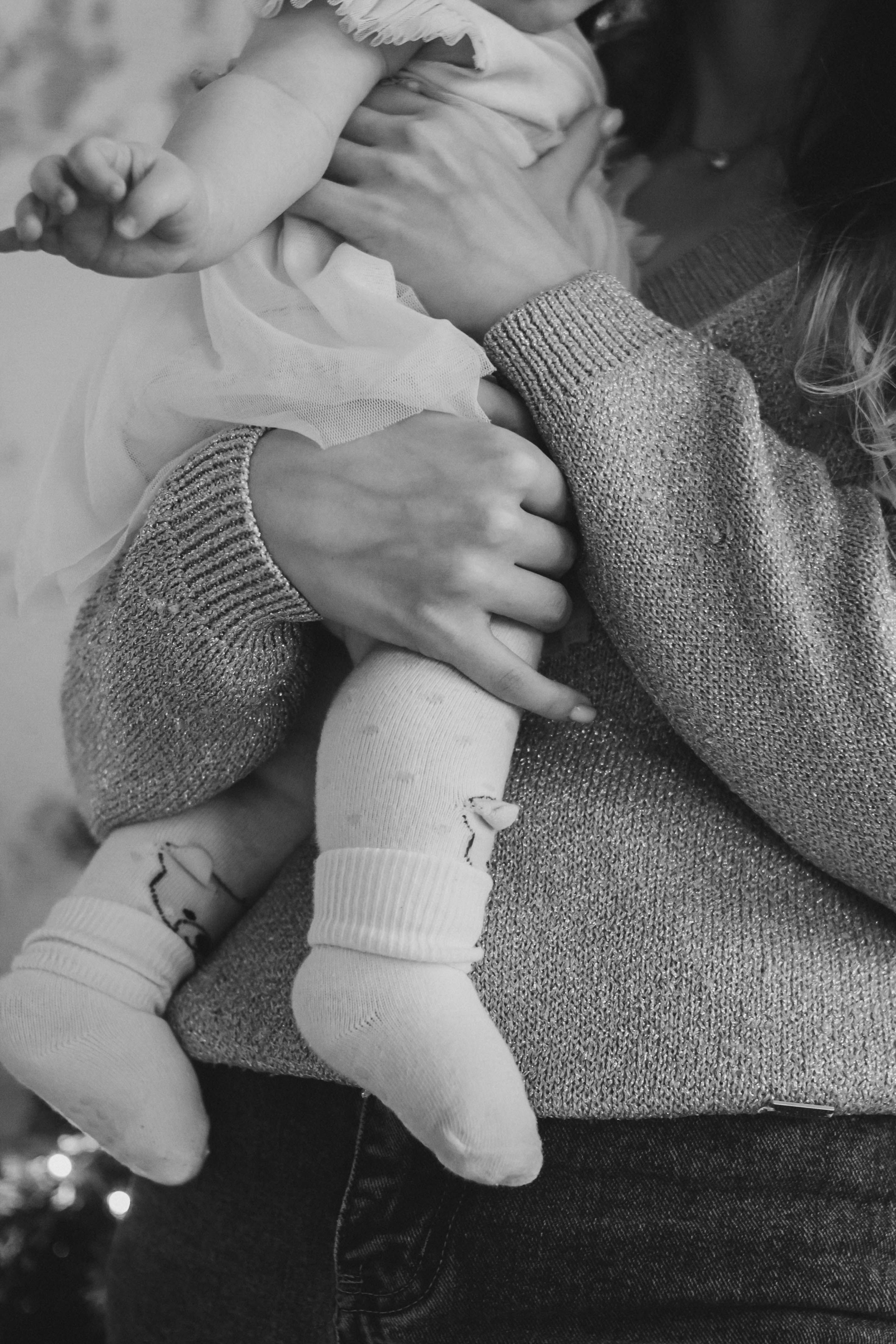 Faceless mother with toddler in arms at home · Free Stock Photo