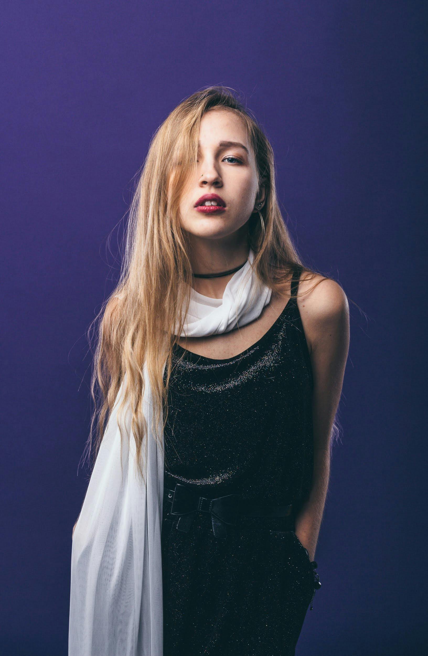 Confident model in casual wear on pastel background · Free Stock Photo