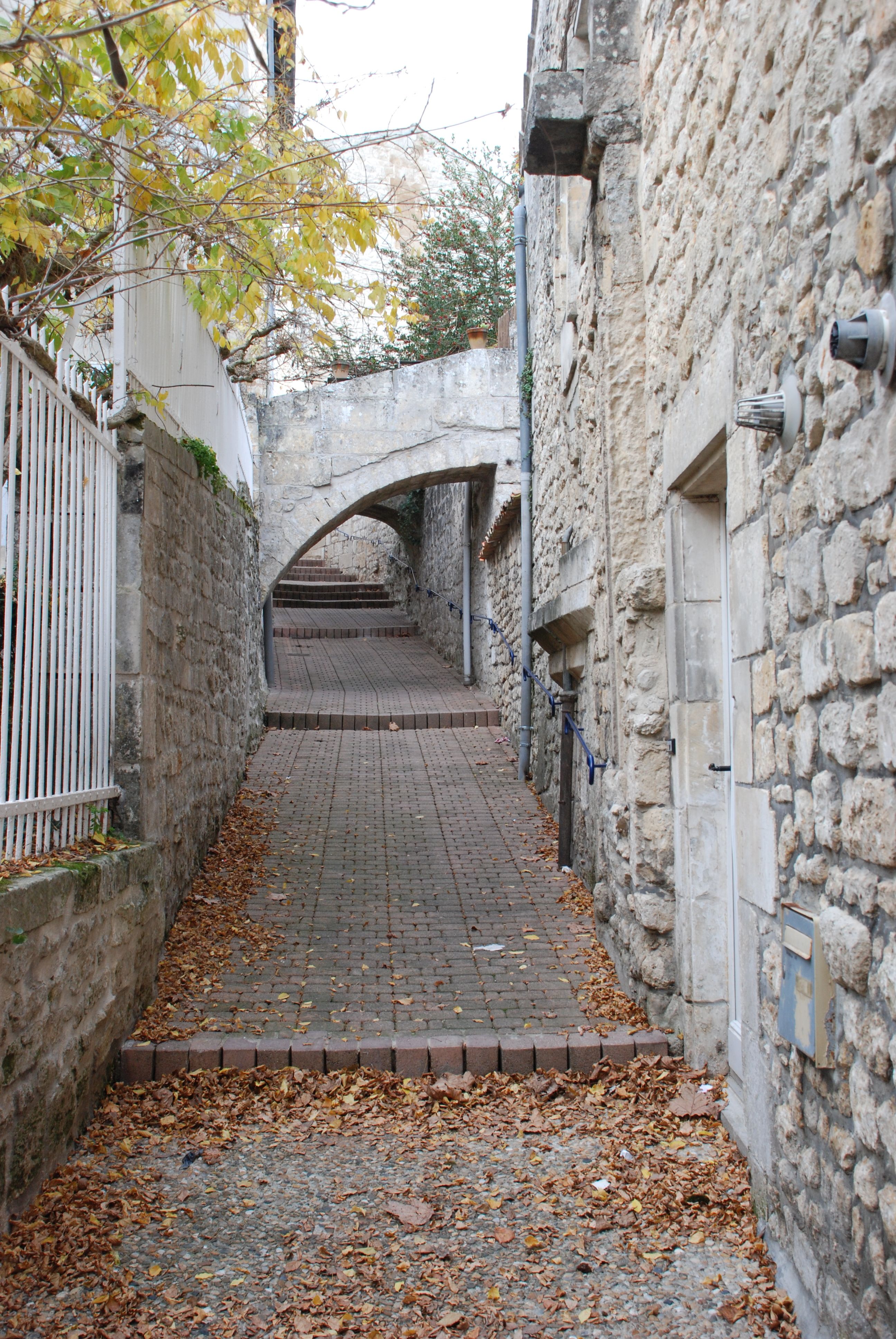 A Narrow Alleyway between Concrete Buildings · Free Stock Photo