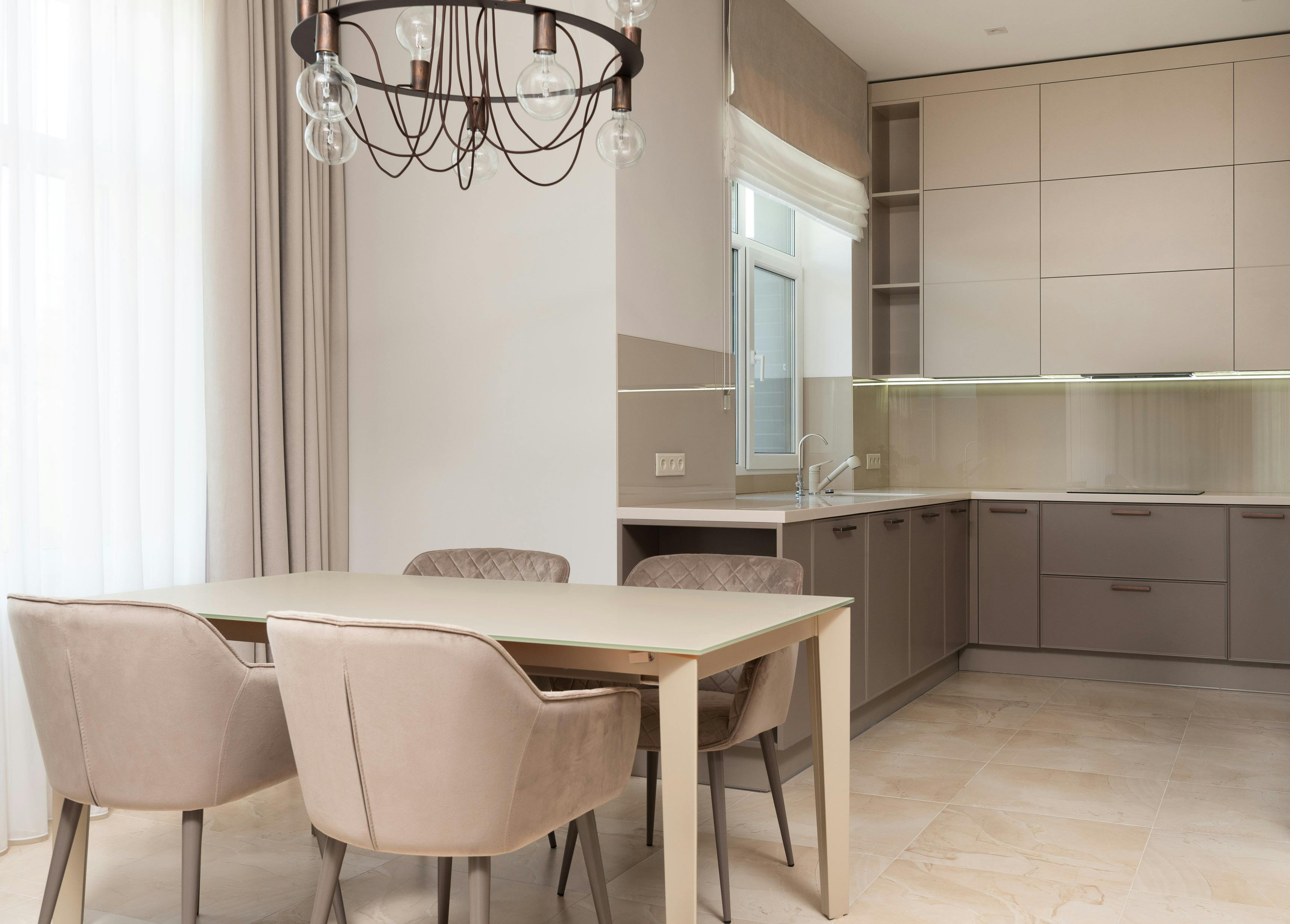 Dining table with chairs in room near windows with curtains · Free ...