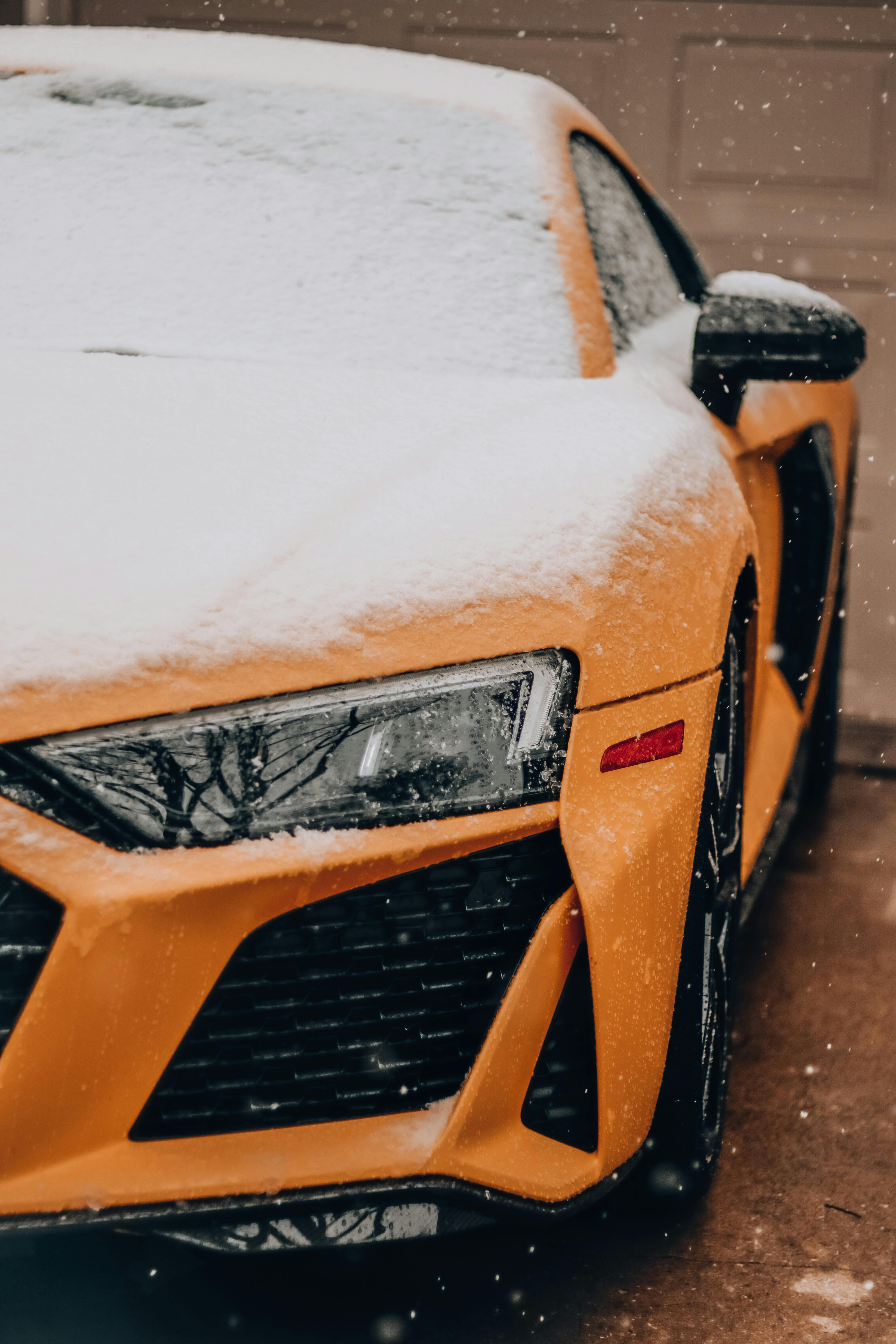 A Sports Car Covered in Snow · Free Stock Photo
