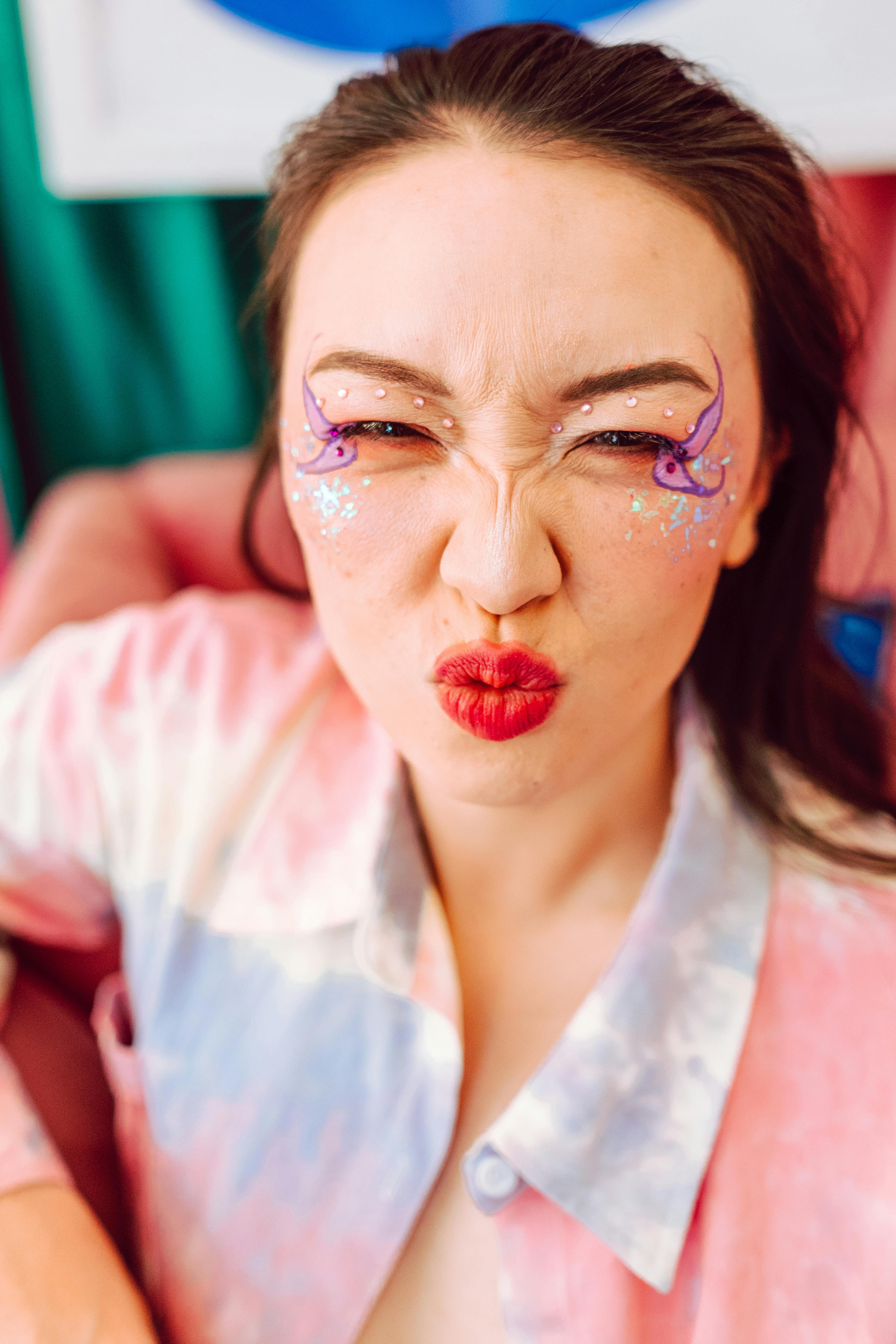 Close-Up Shot of Woman Pouting Her Lips · Free Stock Photo
