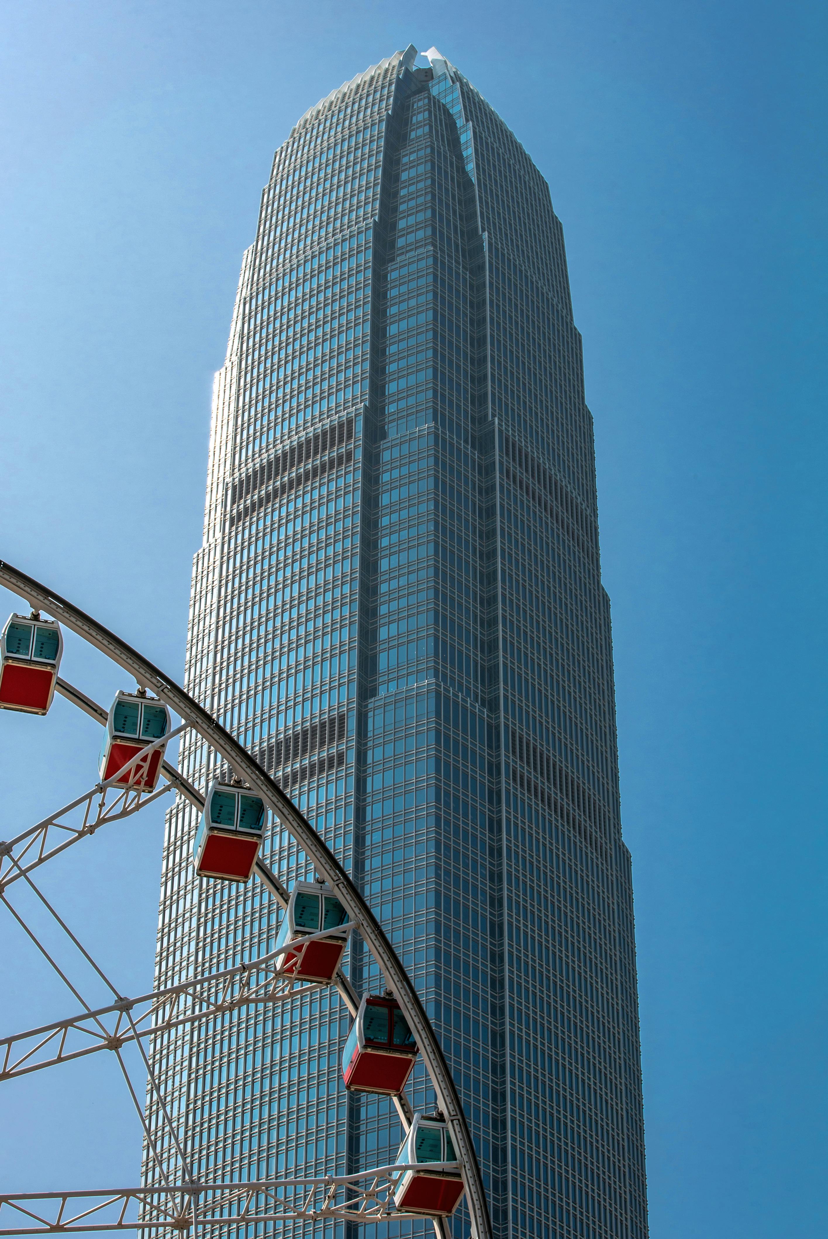 Ferris Wheel Near the Glass Building · Free Stock Photo