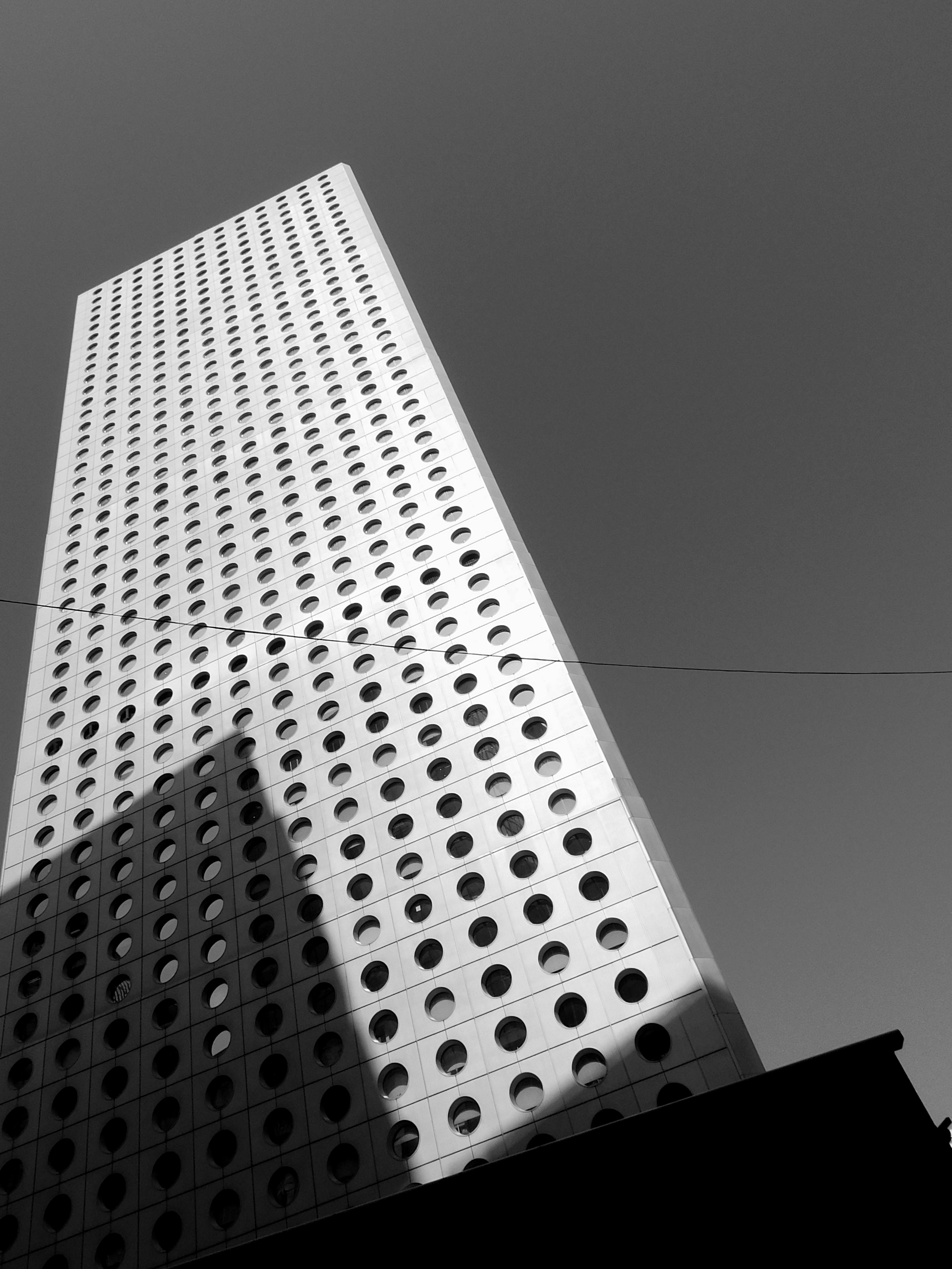 Modern building with blue windows · Free Stock Photo