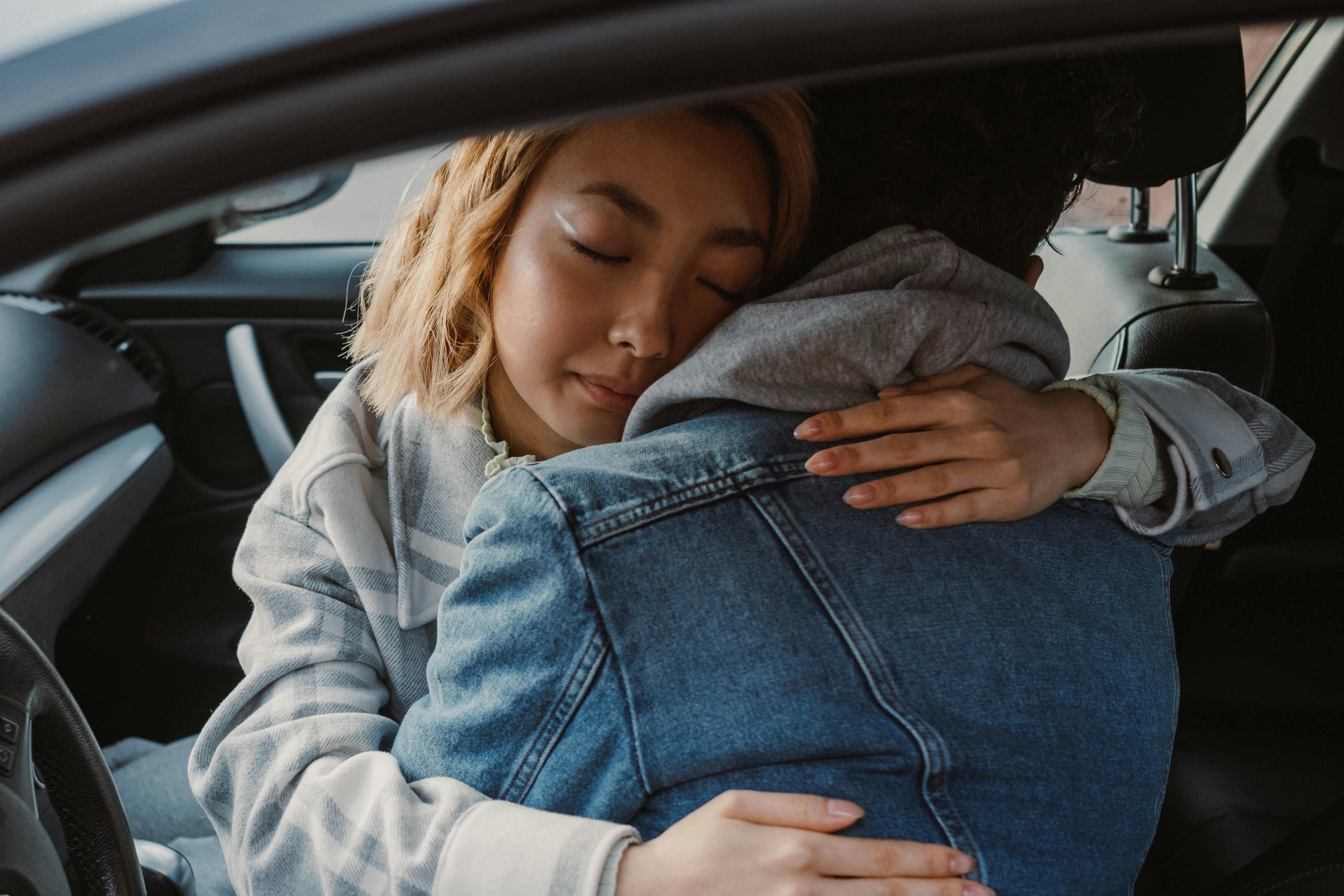 Man Cuddle Woman in Car · Free Stock Photo