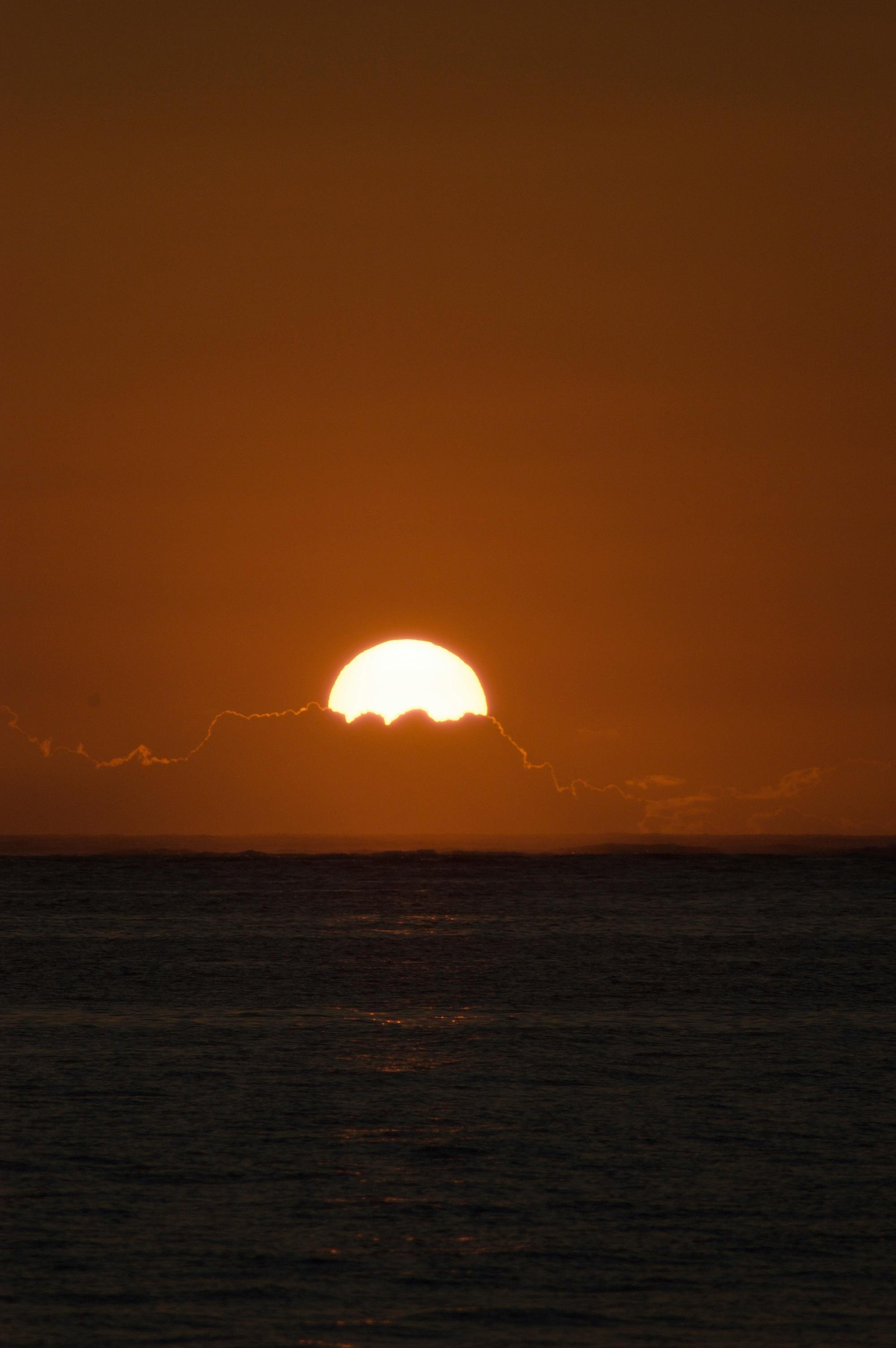 Sun Setting over the Sea · Free Stock Photo