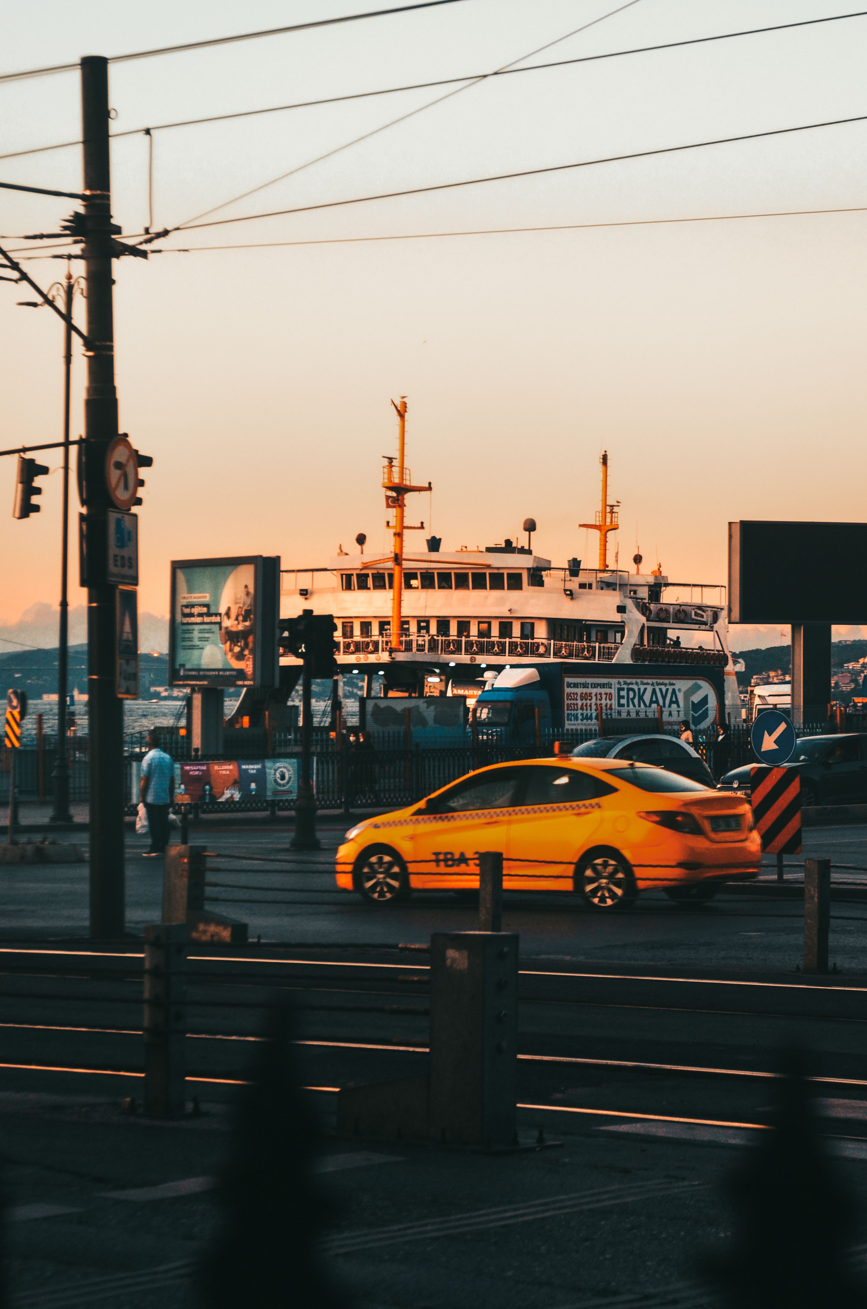 Modern taxi car on city road at sunset · Free Stock Photo