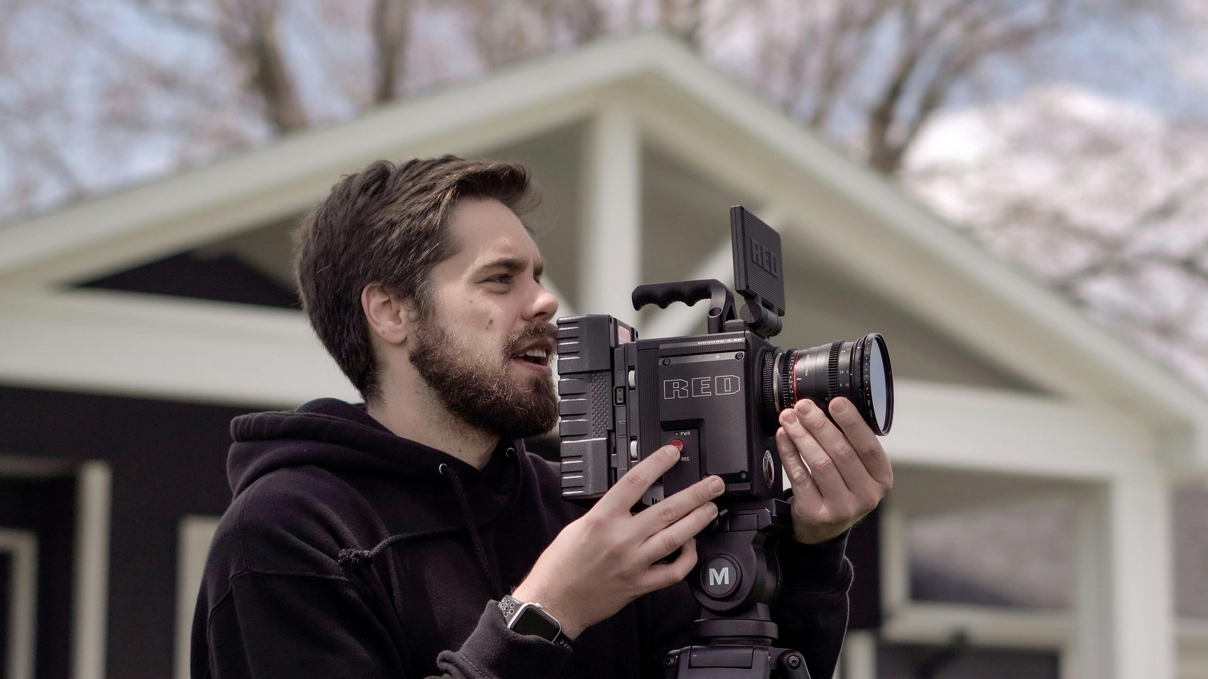 Man Filming with an Analog Camera · Free Stock Photo
