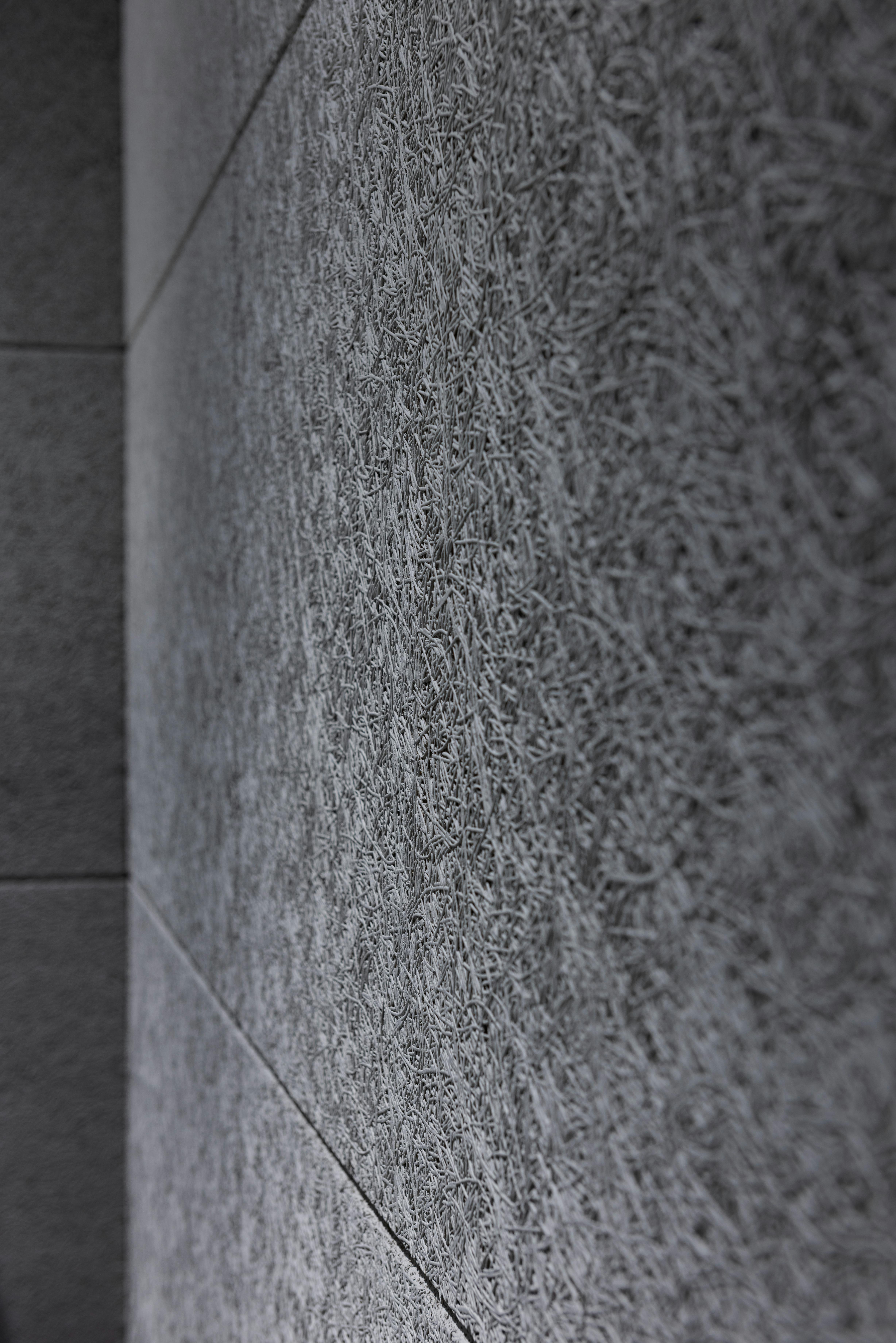 Gray textured wall of building · Free Stock Photo