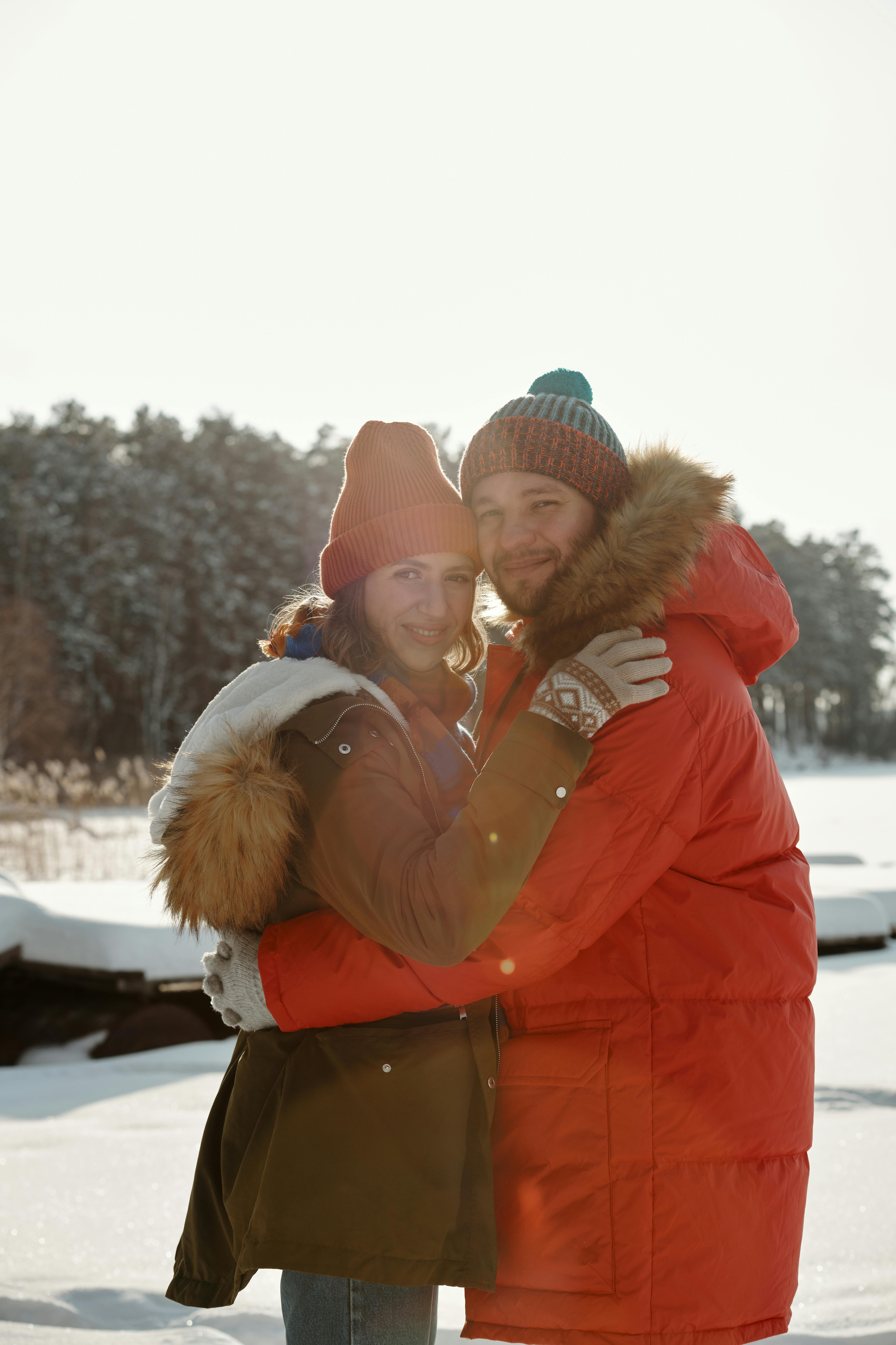 A Couple in Traditional Clothing Hugging Each Other · Free Stock Photo
