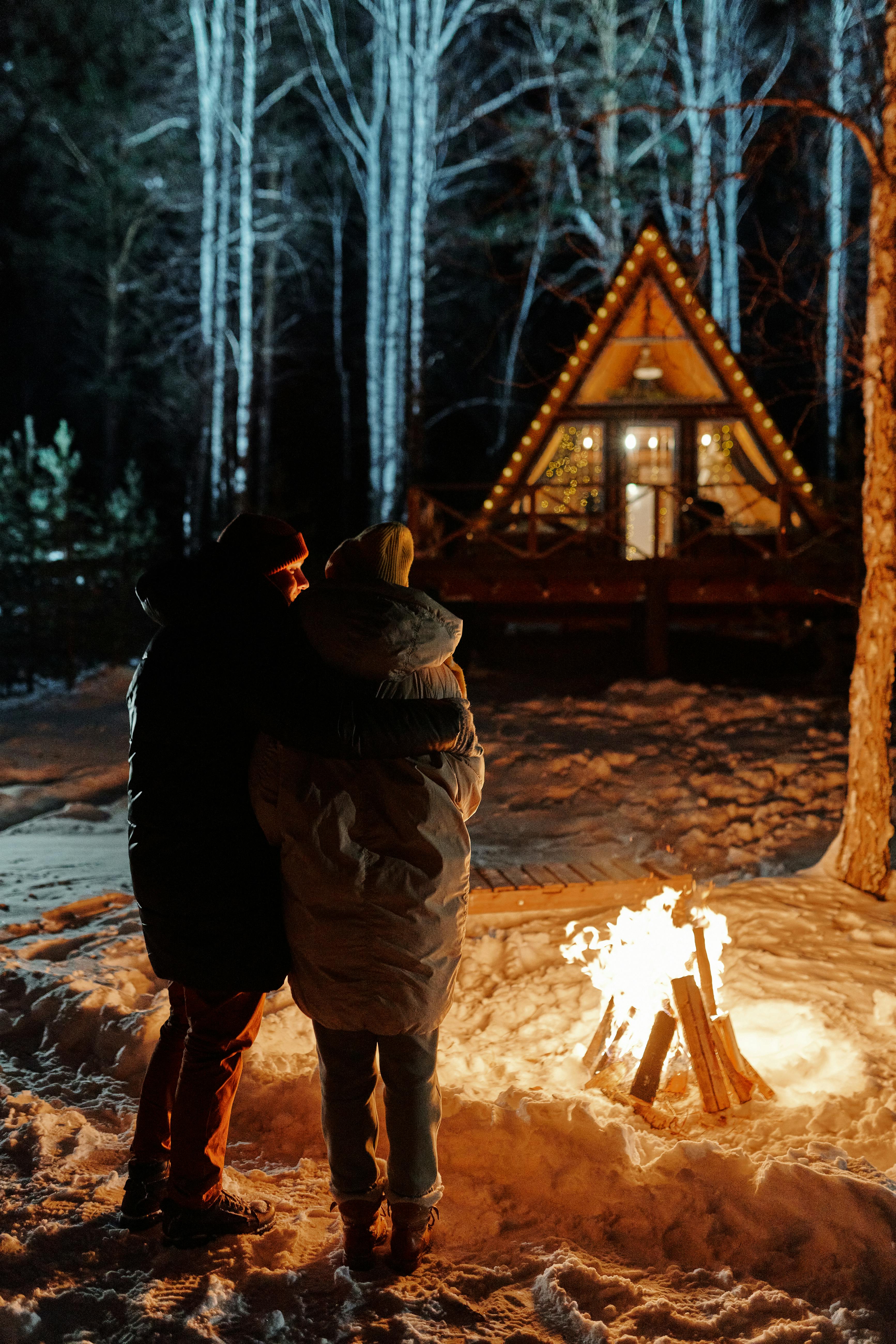 Man and Woman Sitting Beside a Bonfire · Free Stock Photo