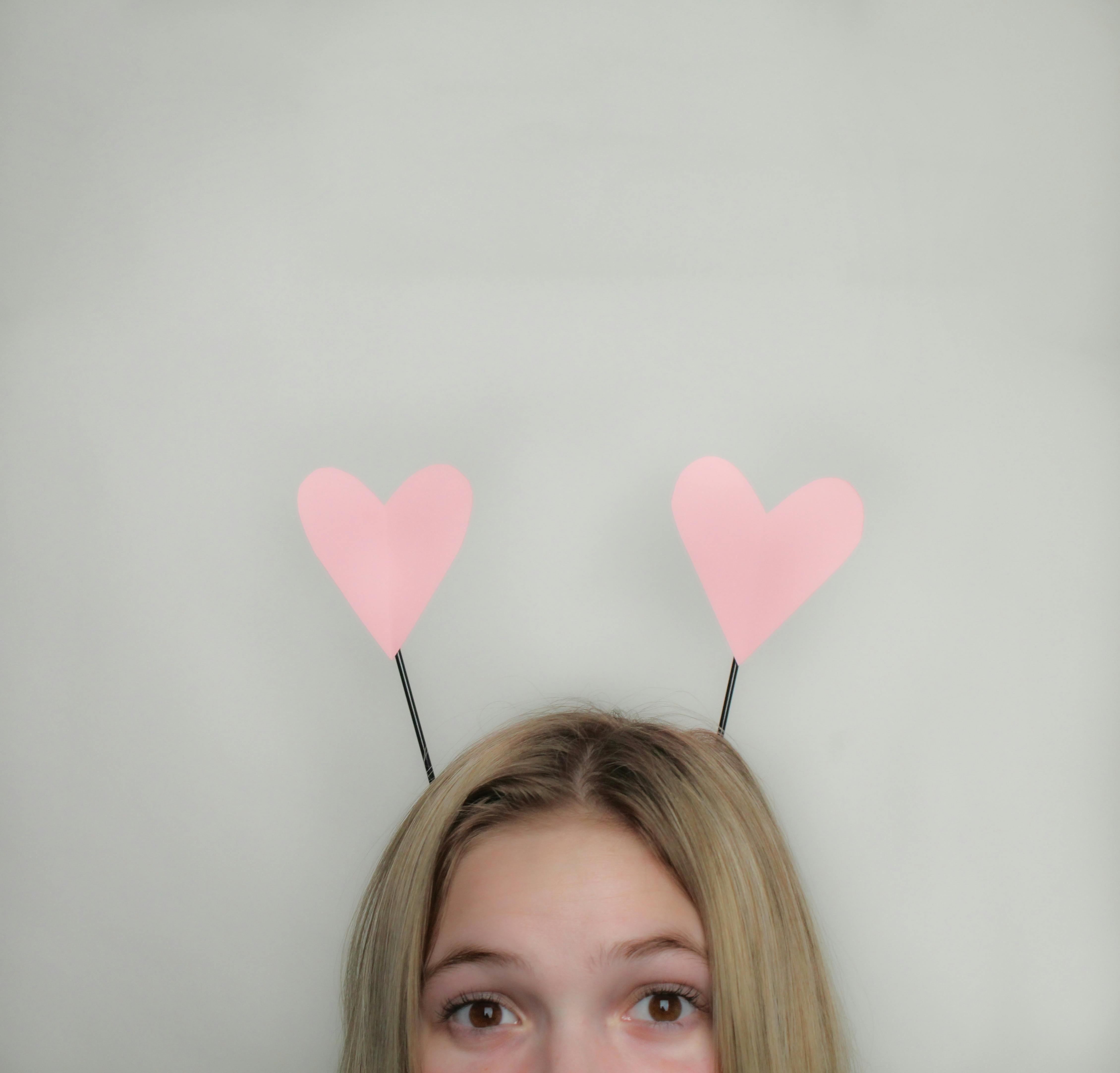 Girl Wearing Pink Hearts Headband · Free Stock Photo