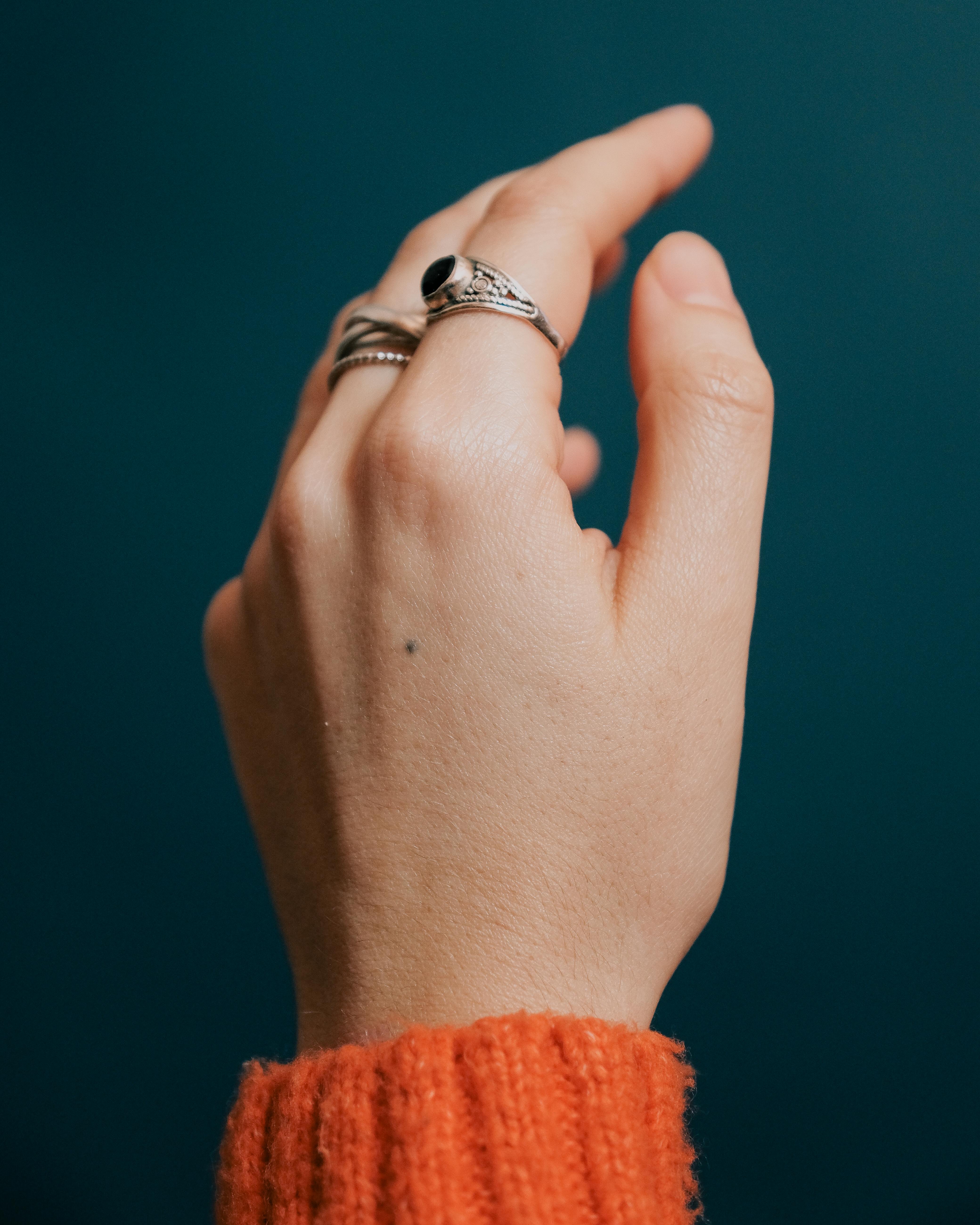 Faceless lady with rings on fingers · Free Stock Photo