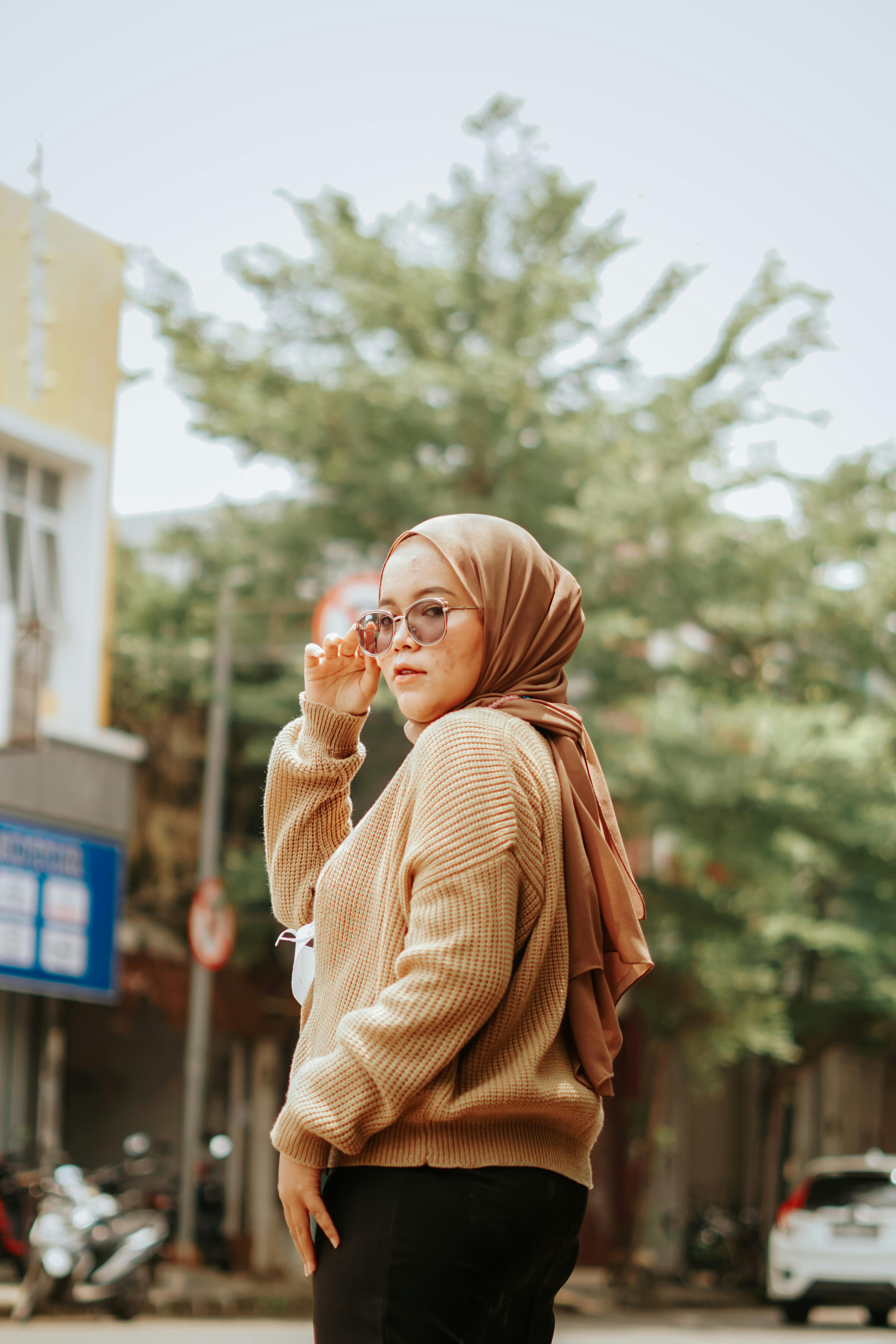 Woman in Hijab Posing in Convertible Car · Free Stock Photo
