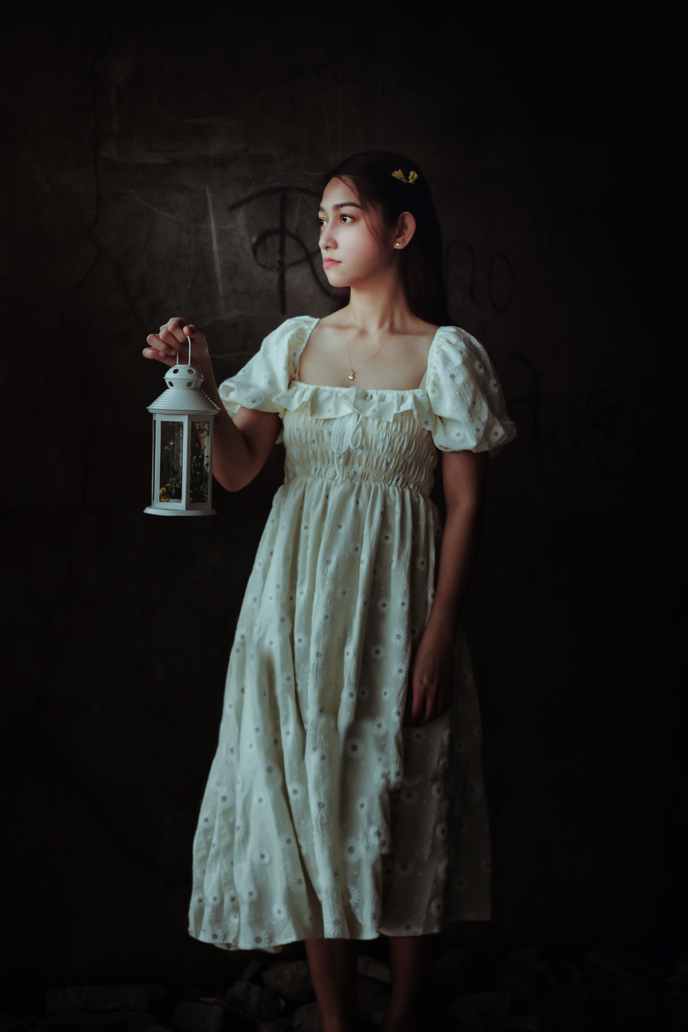 A Person Holding a Lamp in a Dark Cave · Free Stock Photo