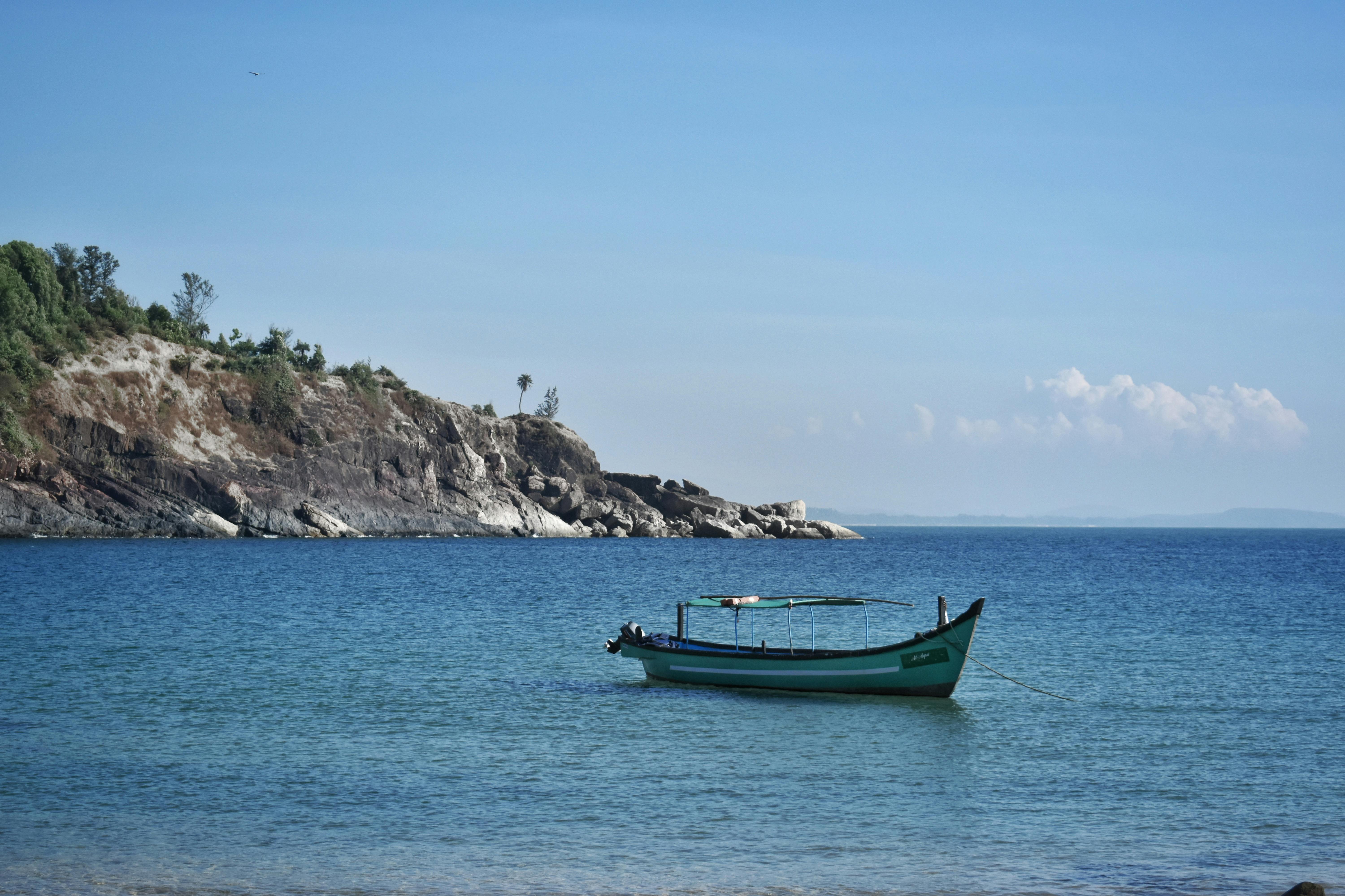 A Small Boat on the Ocean · Free Stock Photo