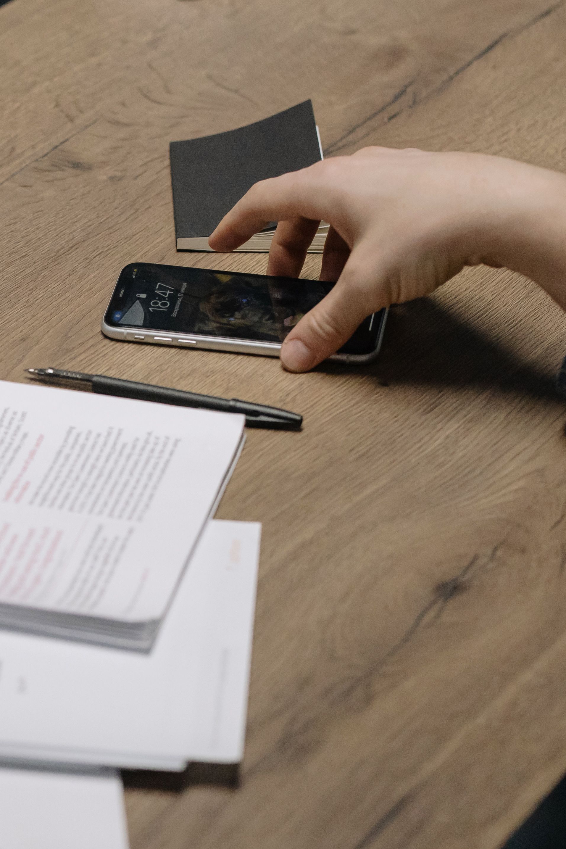 Notebook Beside the Iphone on Table · Free Stock Photo