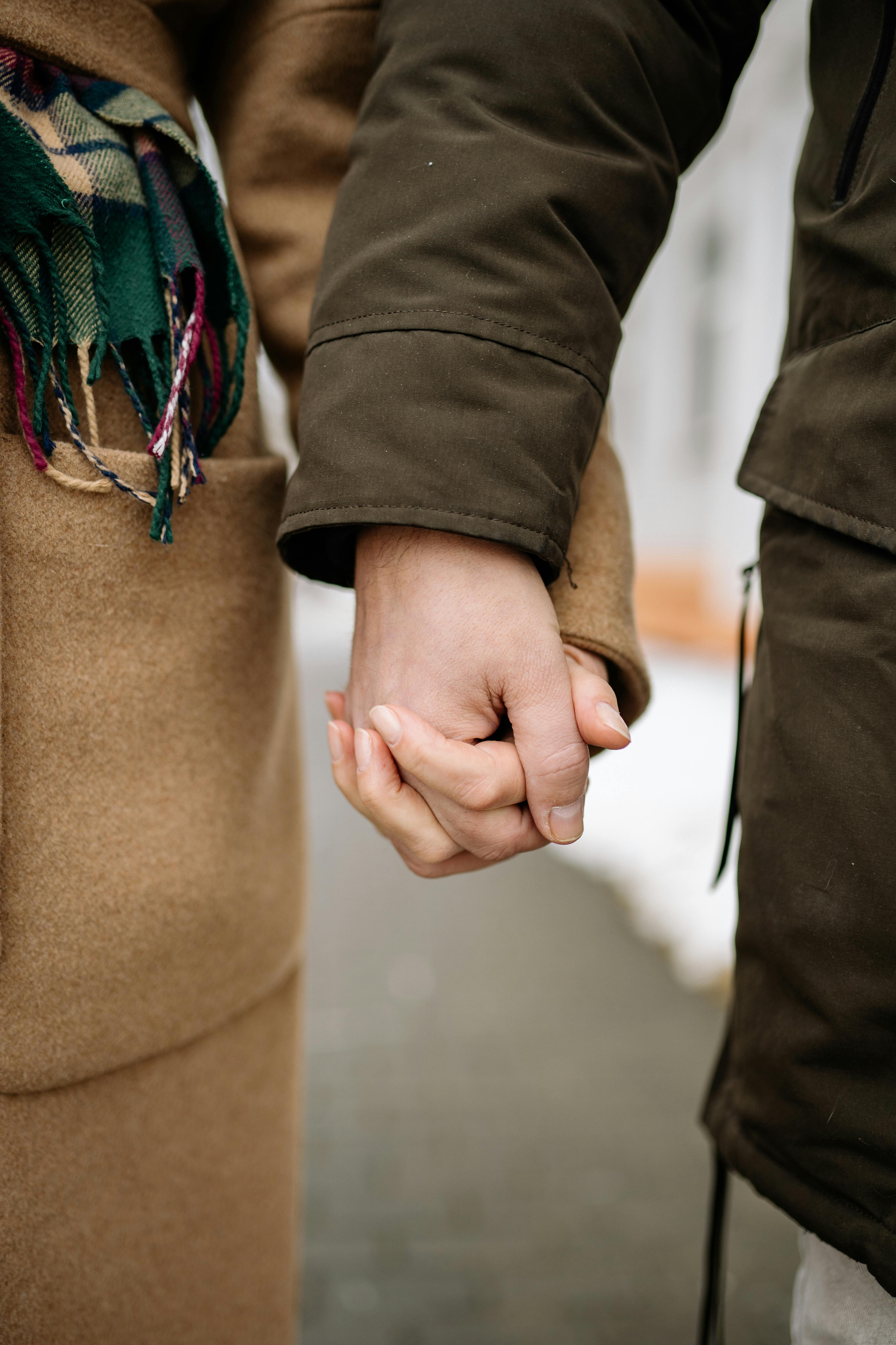 Close Up Photo of People Holding Hands · Free Stock Photo