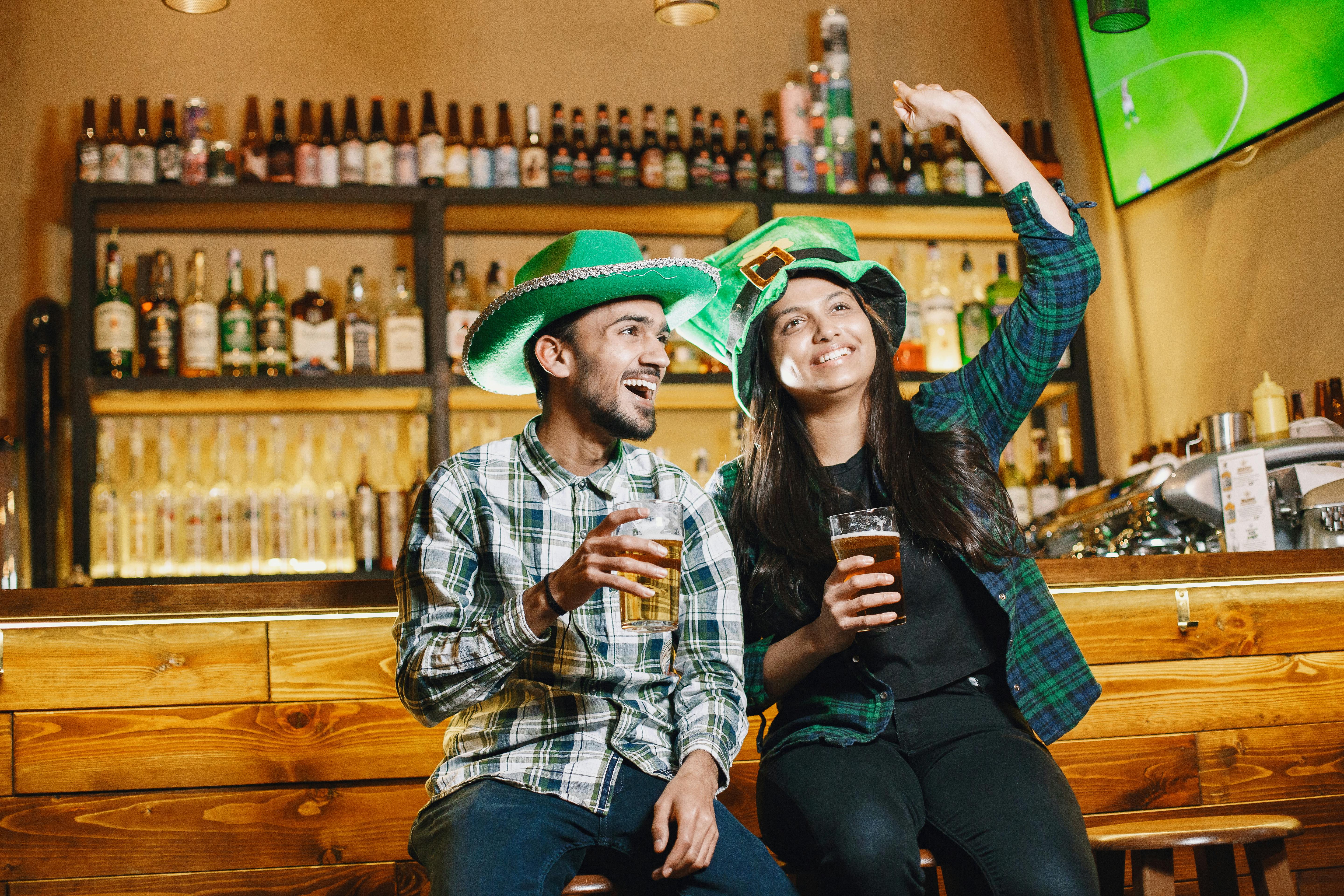 Two People Celebrating in a Pub · Free Stock Photo